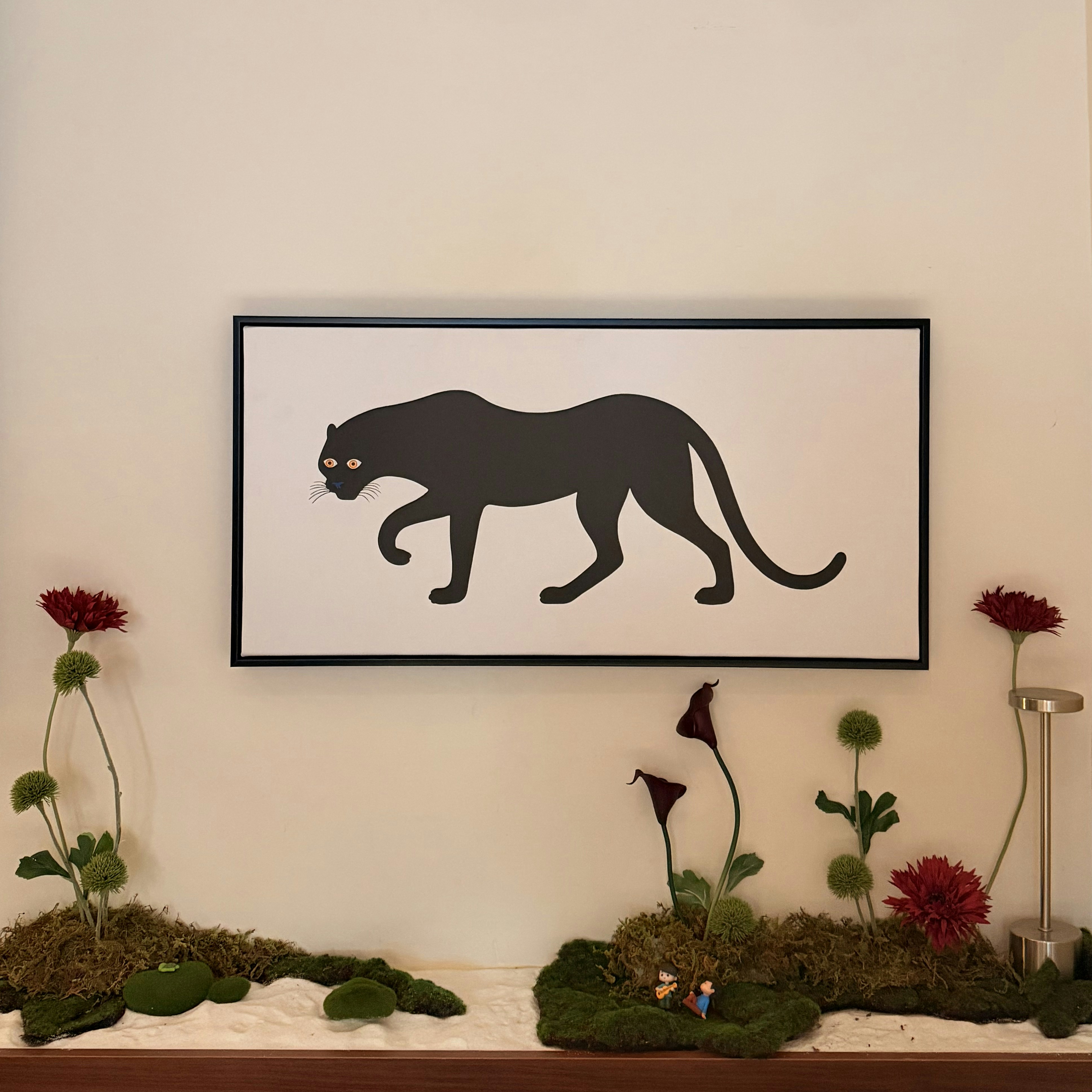 Black panther silhouette on white background with flowers