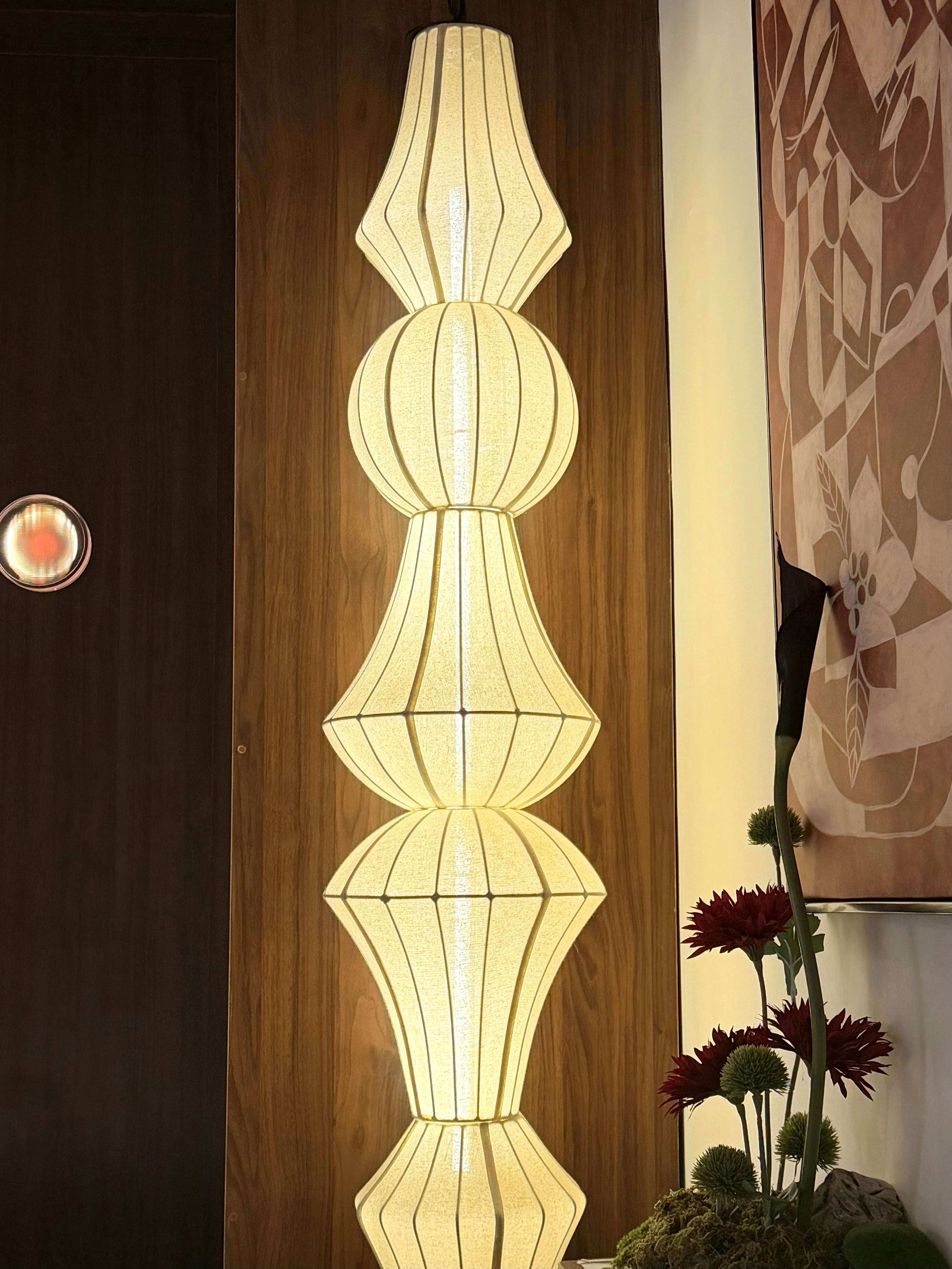 Vertical Lantern Trio: A Softly Lit Mid-Century Interior