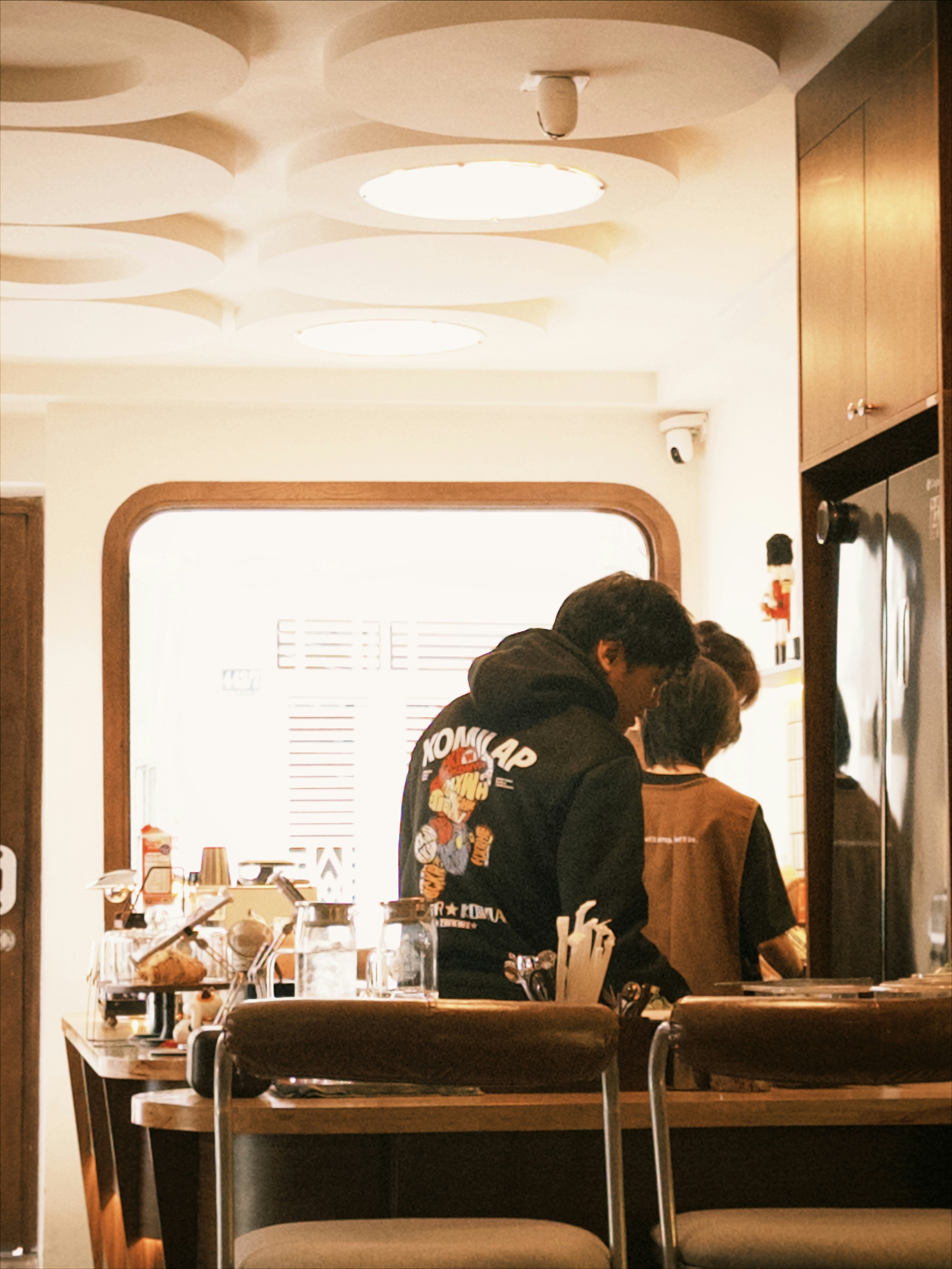 Backlit Crew in a Cozy Café Corner