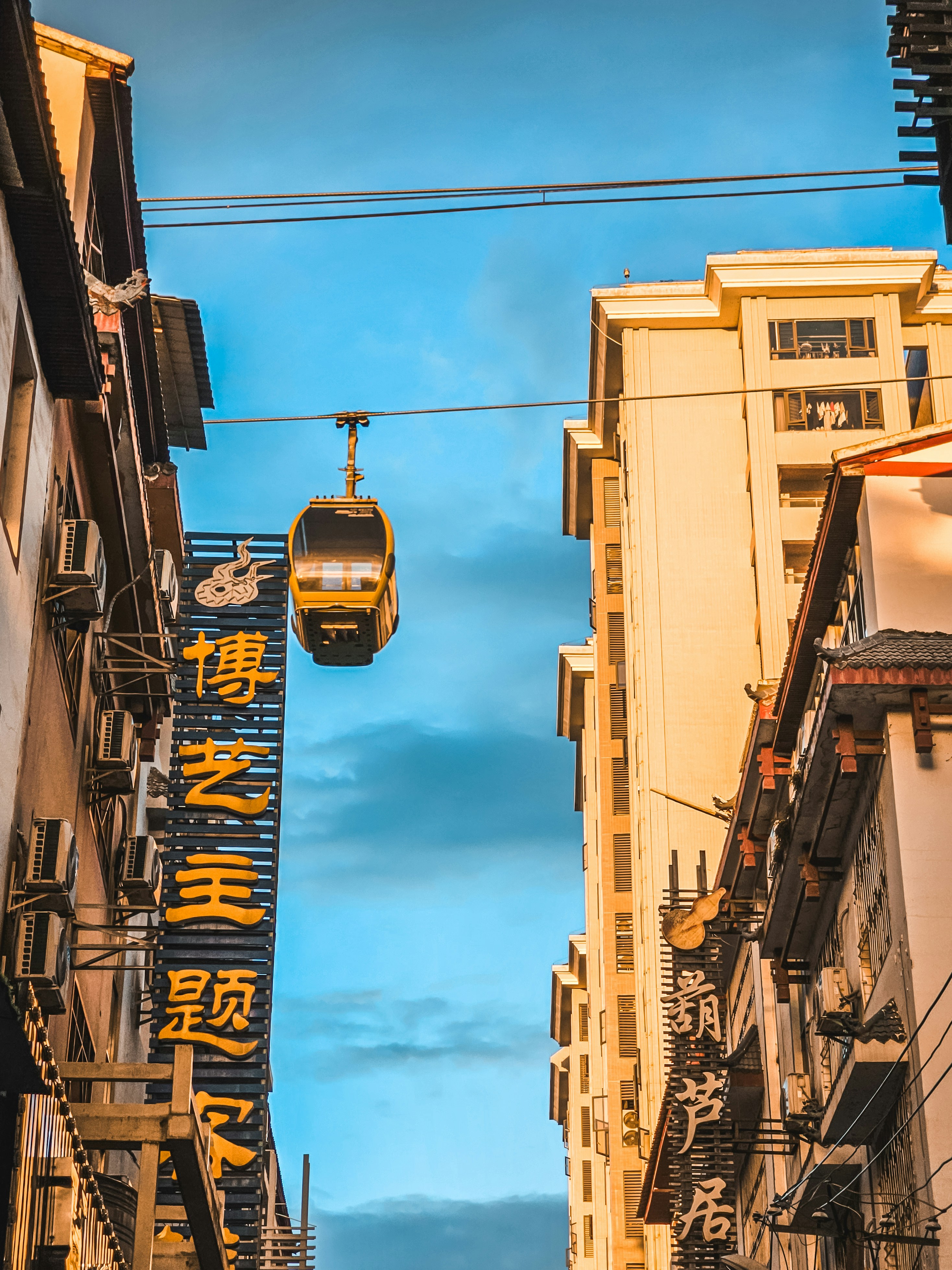 Cable Car Over the Skyline: Urban Doors and Golden Hour