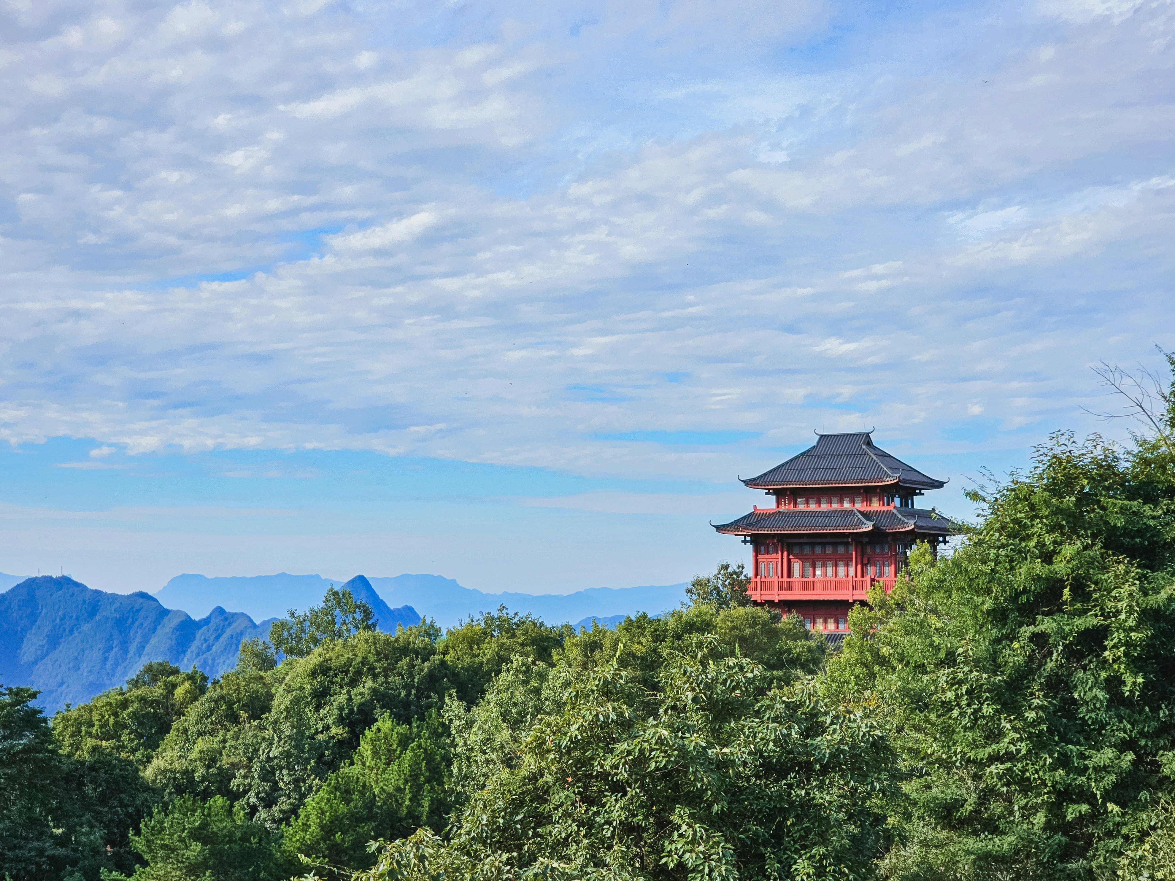 Red Pagoda Rising Above the Green Crest