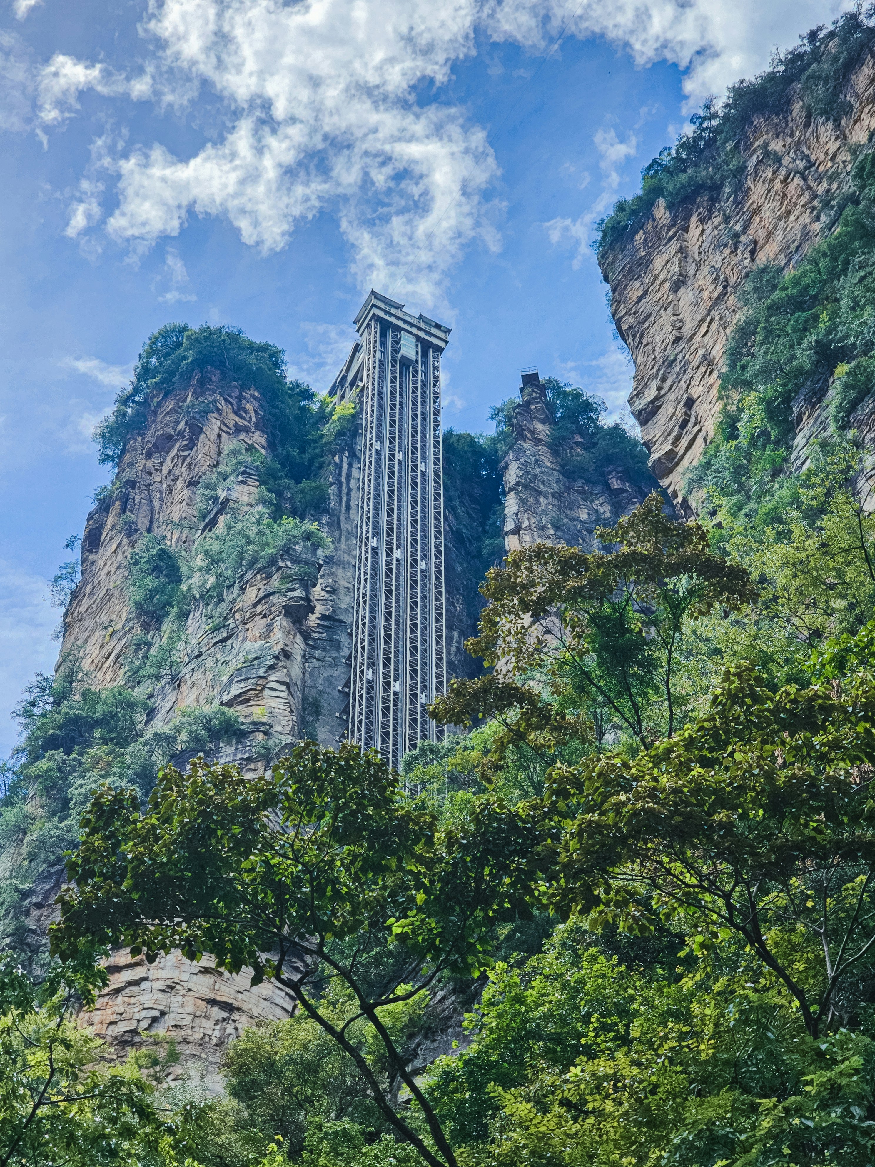 Vertical Summit: A Tower Rising from the Cliffside Gorge