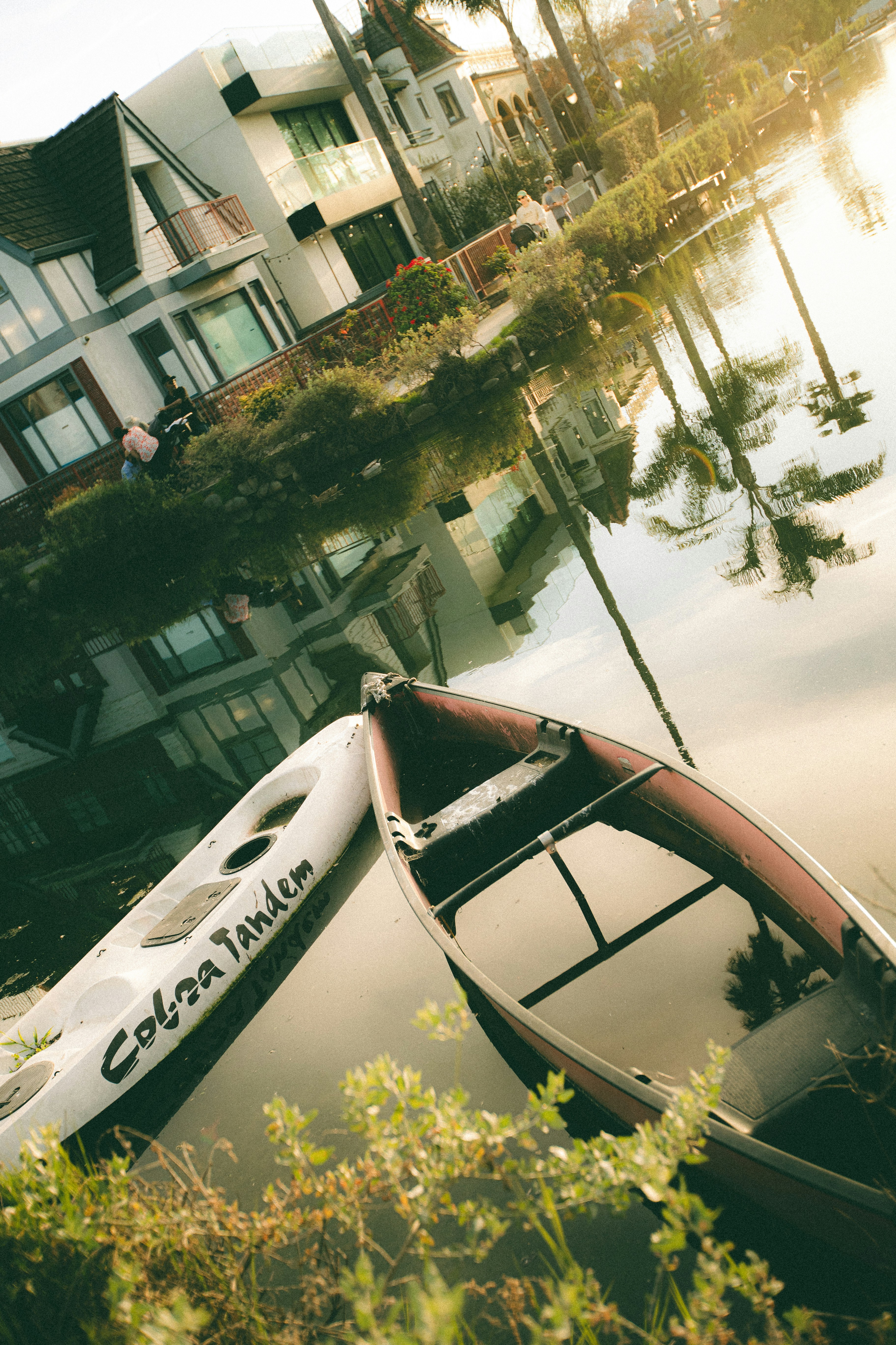 Reflected Canal and Cradled Boats in a Quiet Waterfront Lane