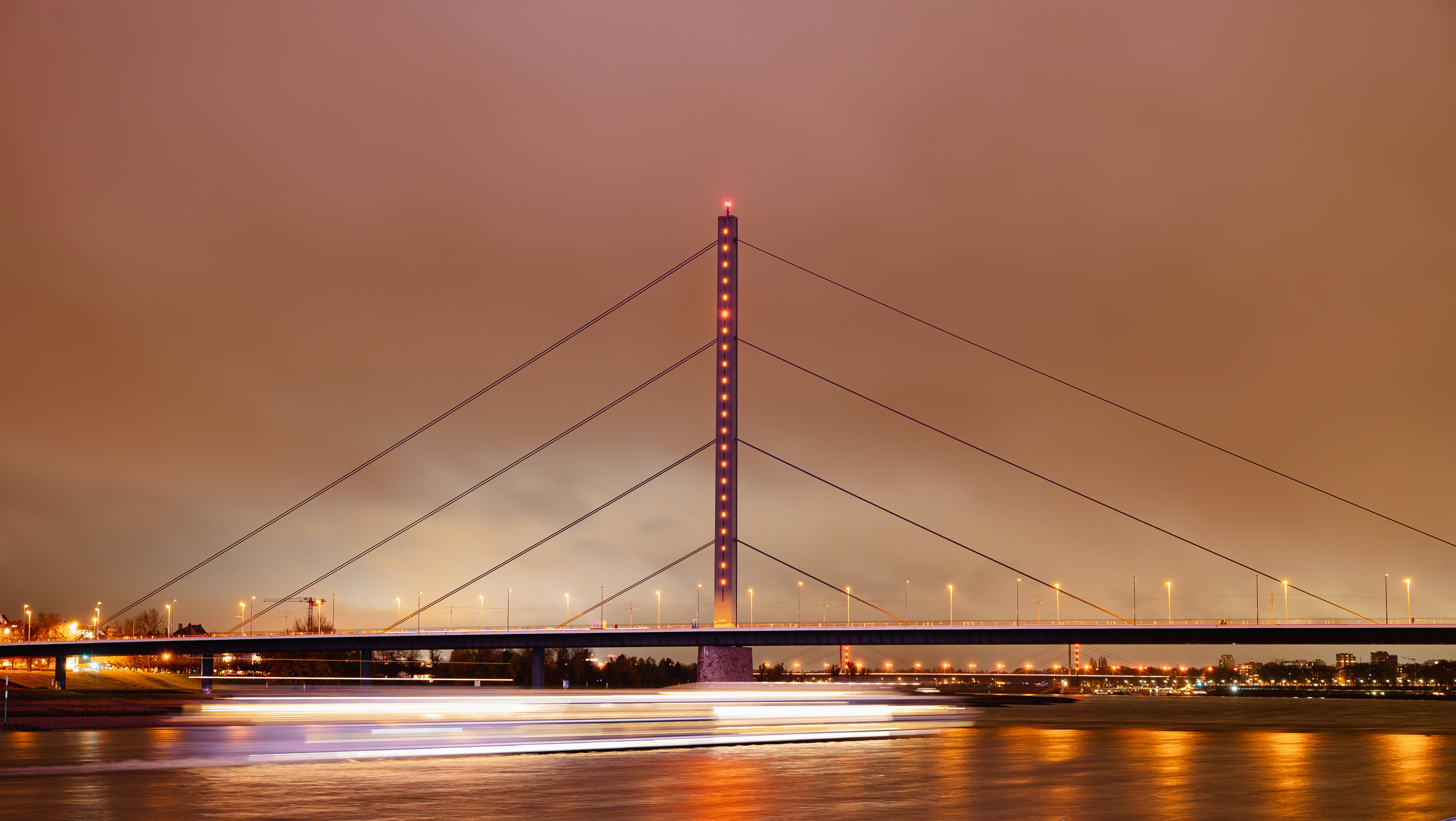 Glowing Cable-Driven Bridge at Dusk