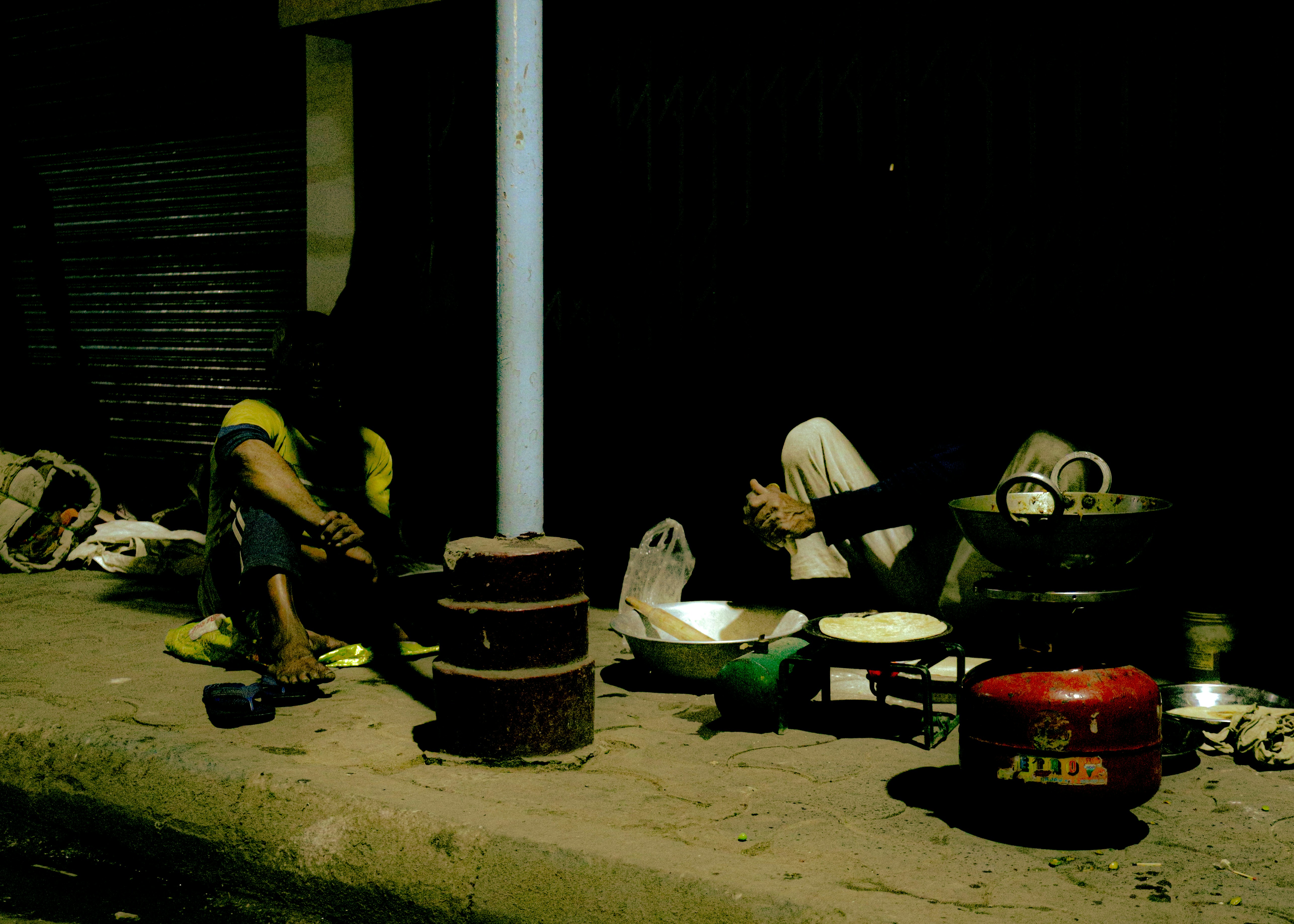 Nightmarket Quiet: Stranded Figures Amid Stalls