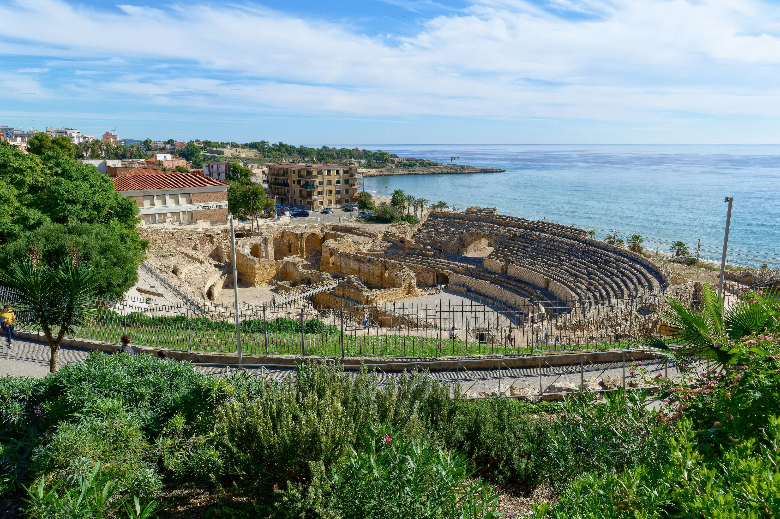 Ancient roman amphitheater by the mediterranean sea.