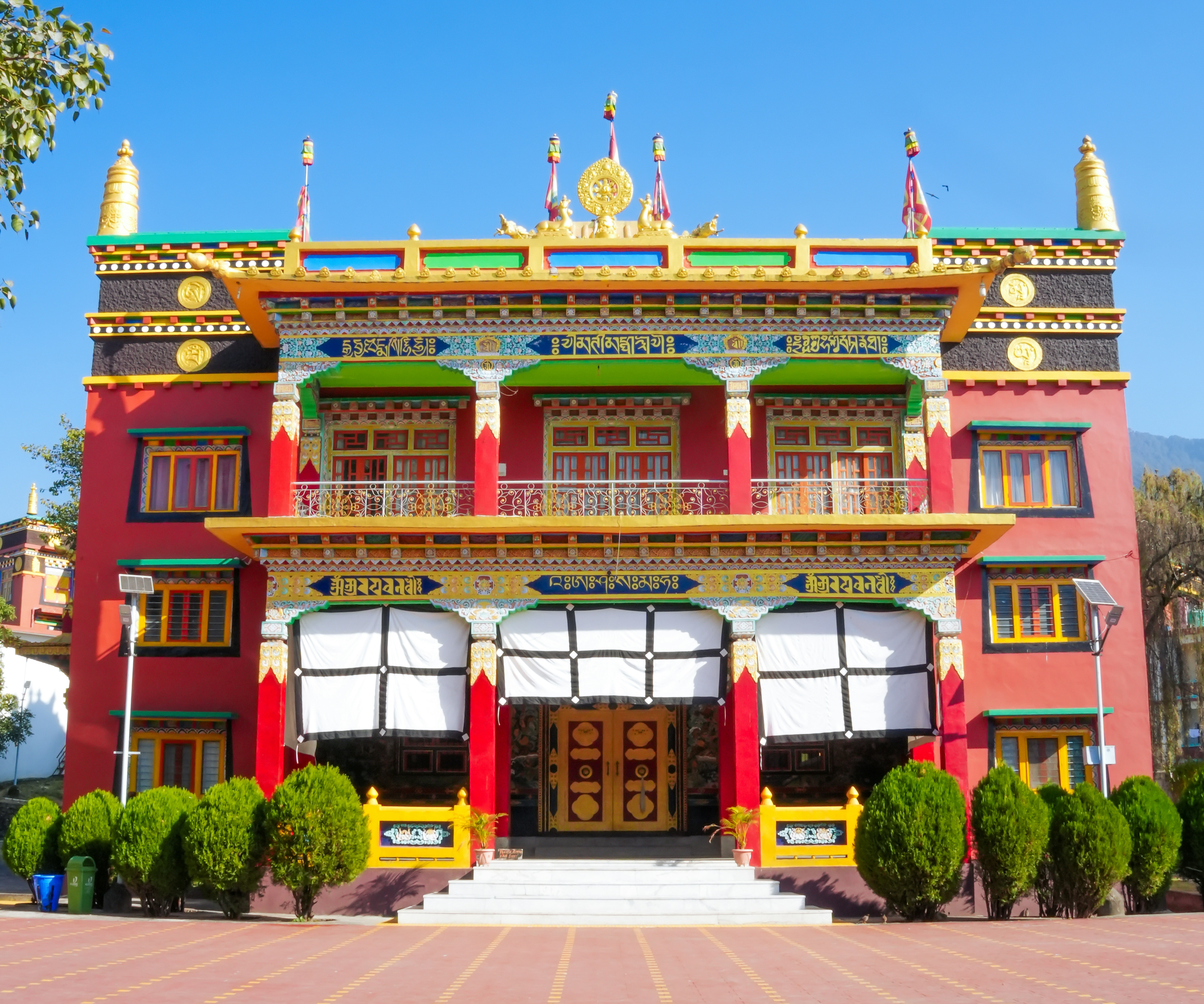 Ornate Tibetan Palace Facade Basks Under Desert Blue