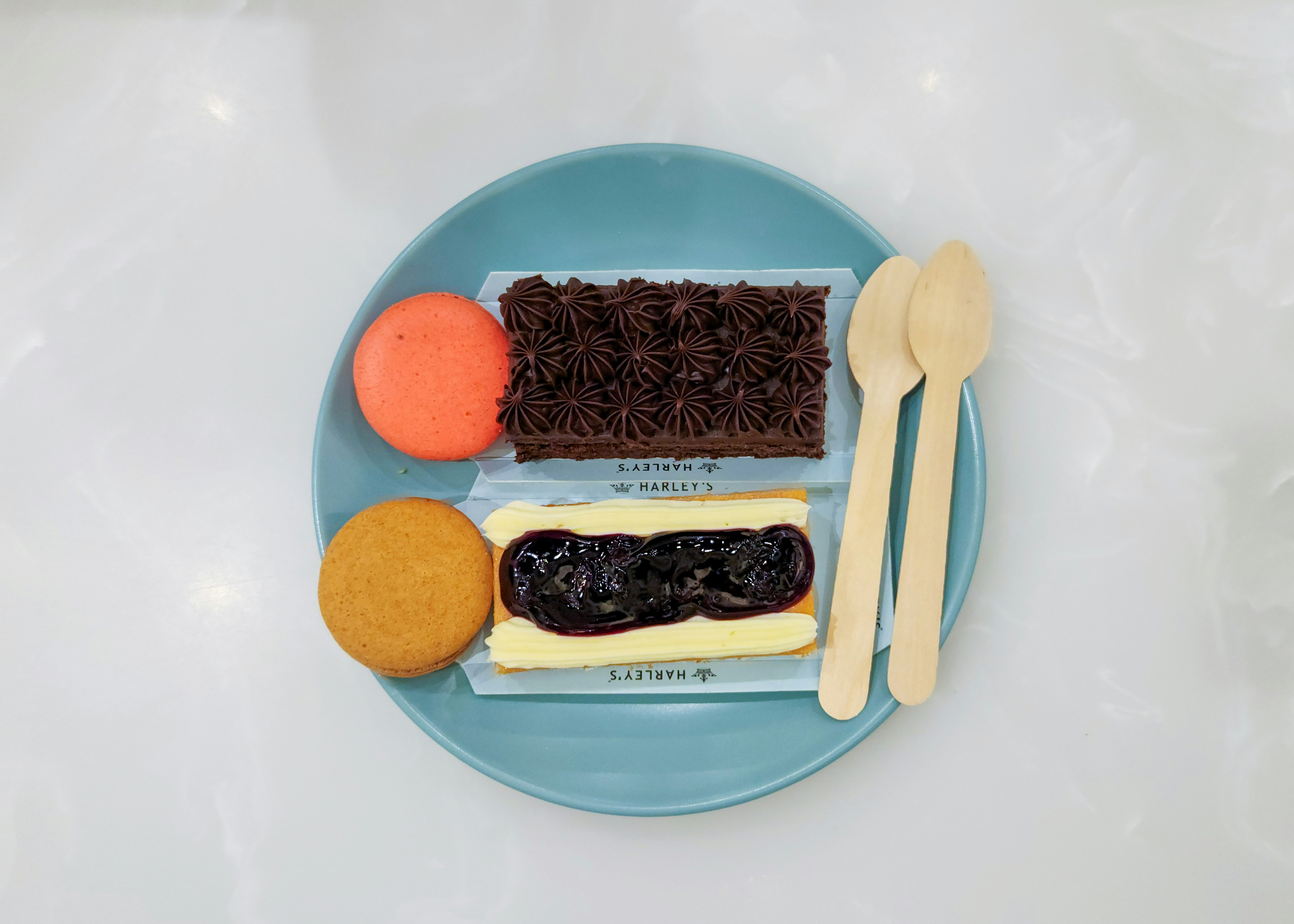 Blue plate, sweet symmetry: a trio of pastries arranged with precision