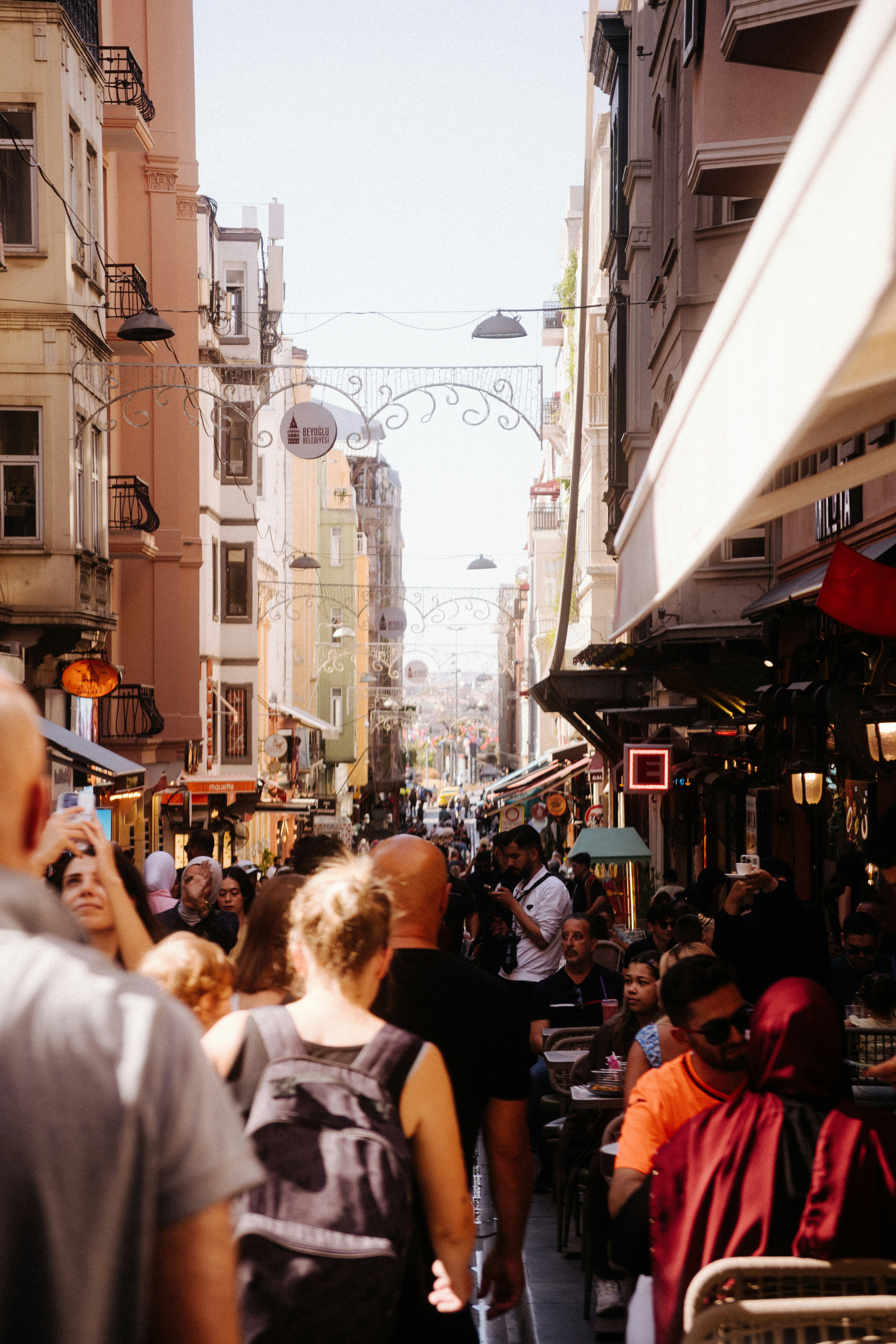 Street Serenade: A Busy Calle Filled with Light and People