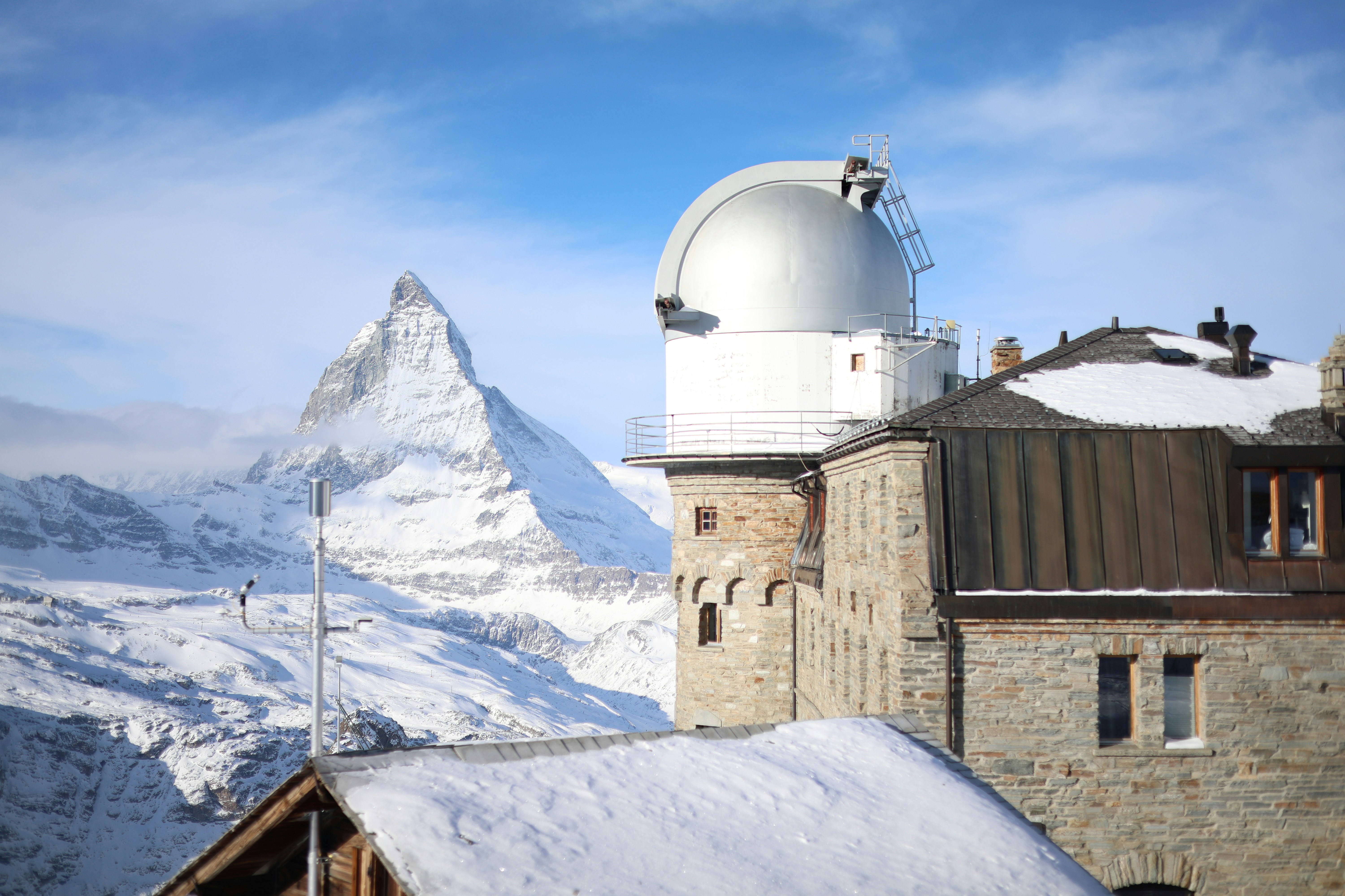 Snowbound Observatory under a Lone Mountain