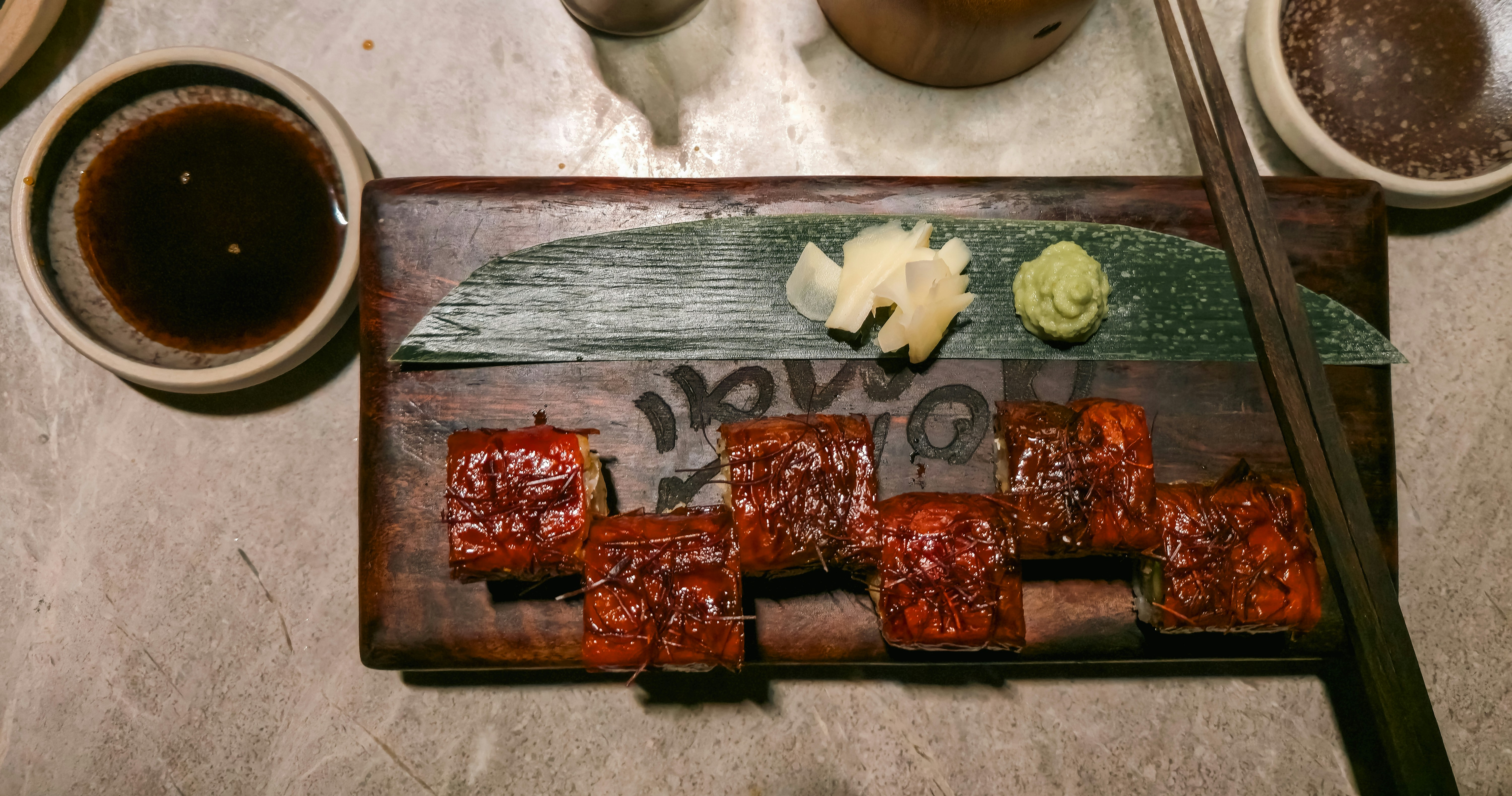 Charred Skewers on a Wooden Board: A Bite into Umami