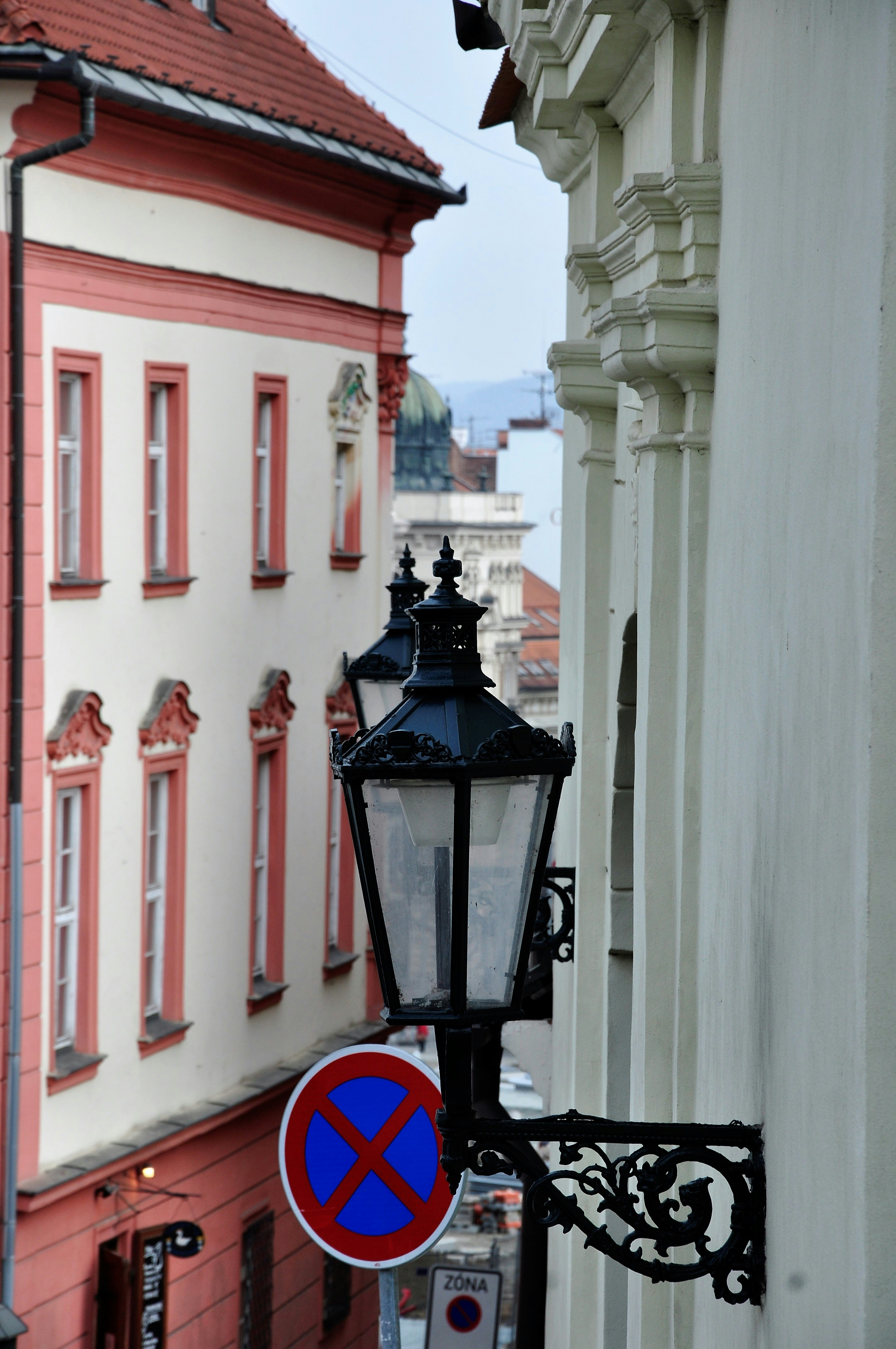 Lantern Clerk: A Streetcorner Between Facades