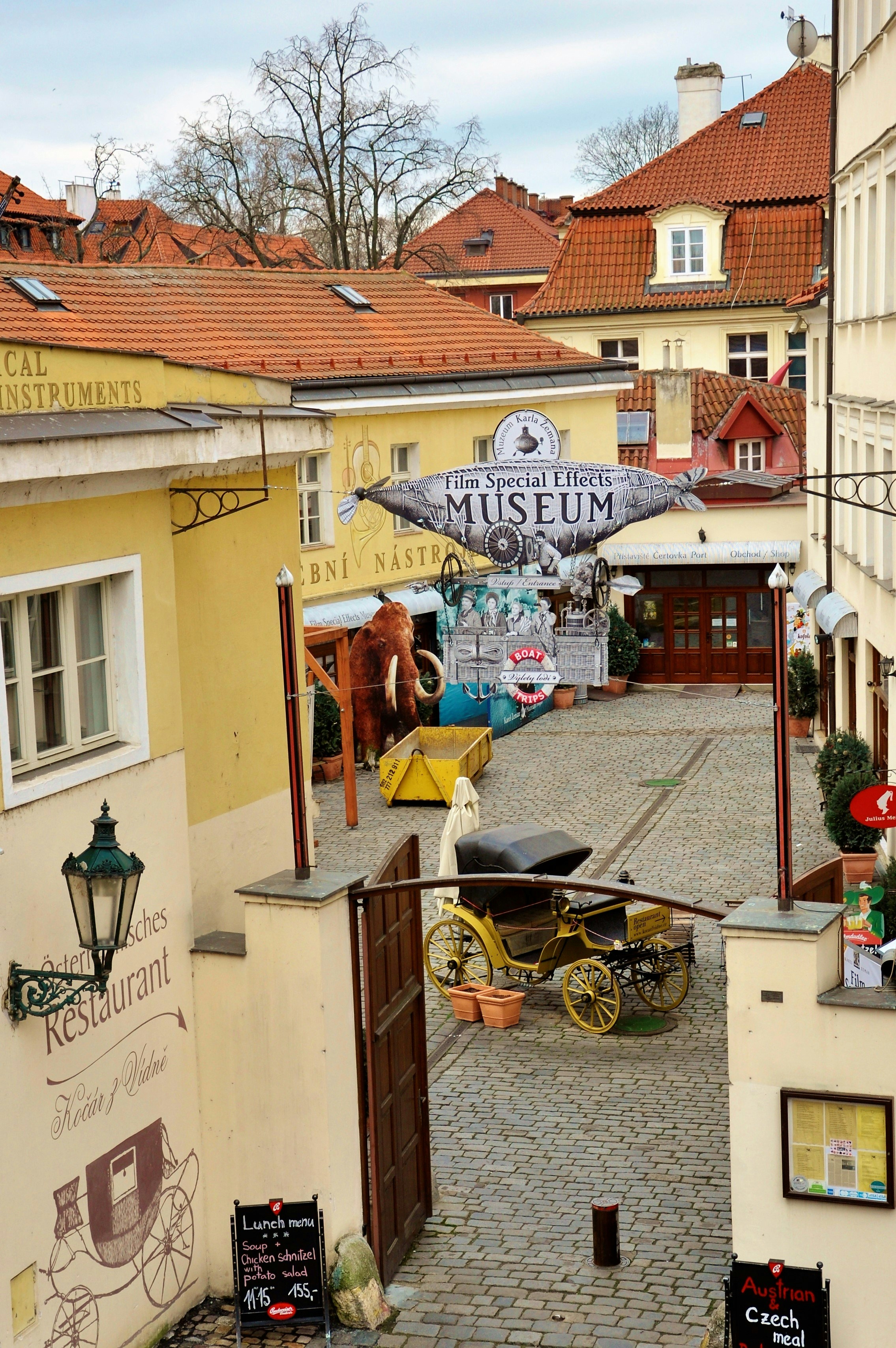 Gateway to a Vintage Street: The Museum Arch Over Cobblestones