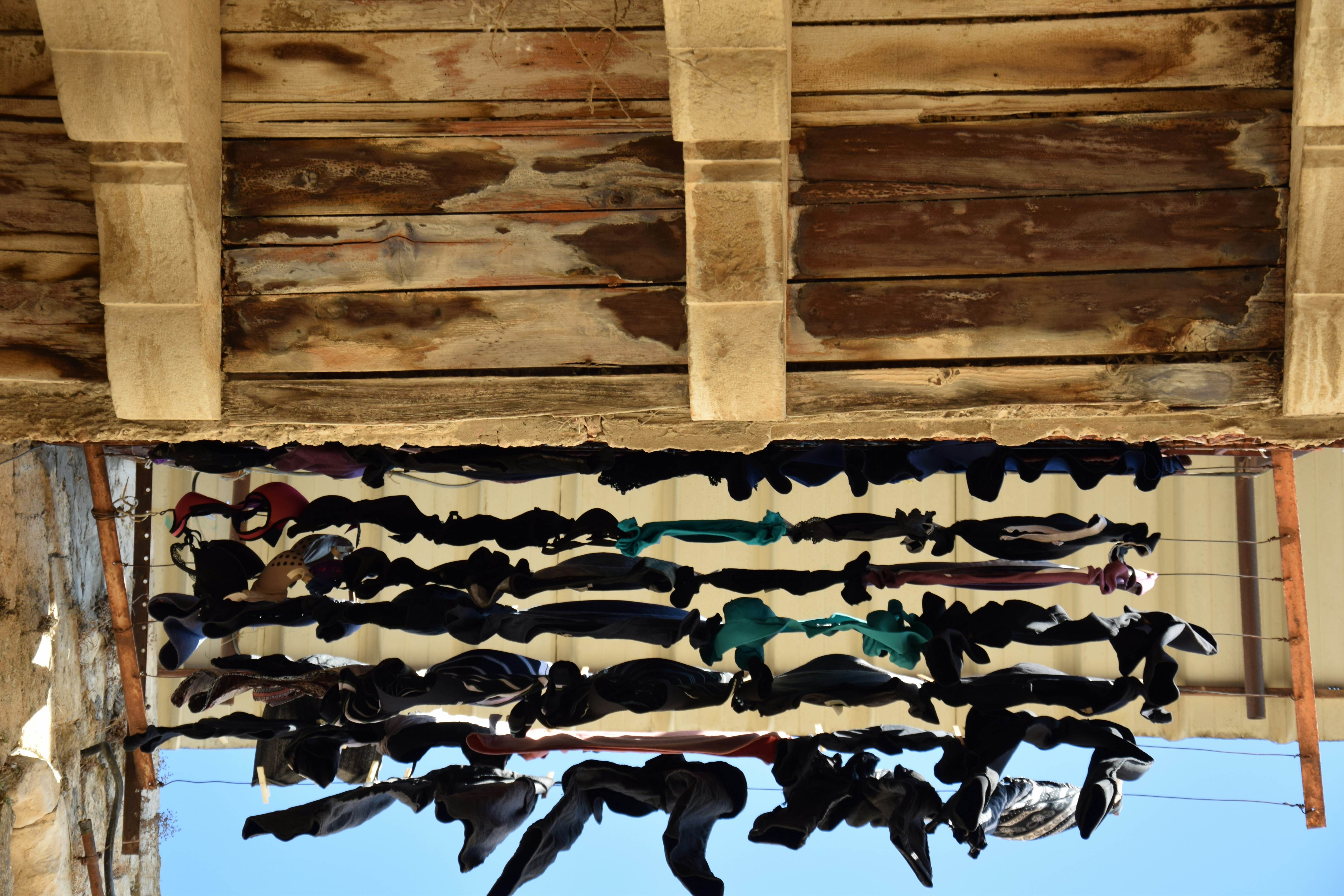 Laundry on the Line Between Rustic Beams