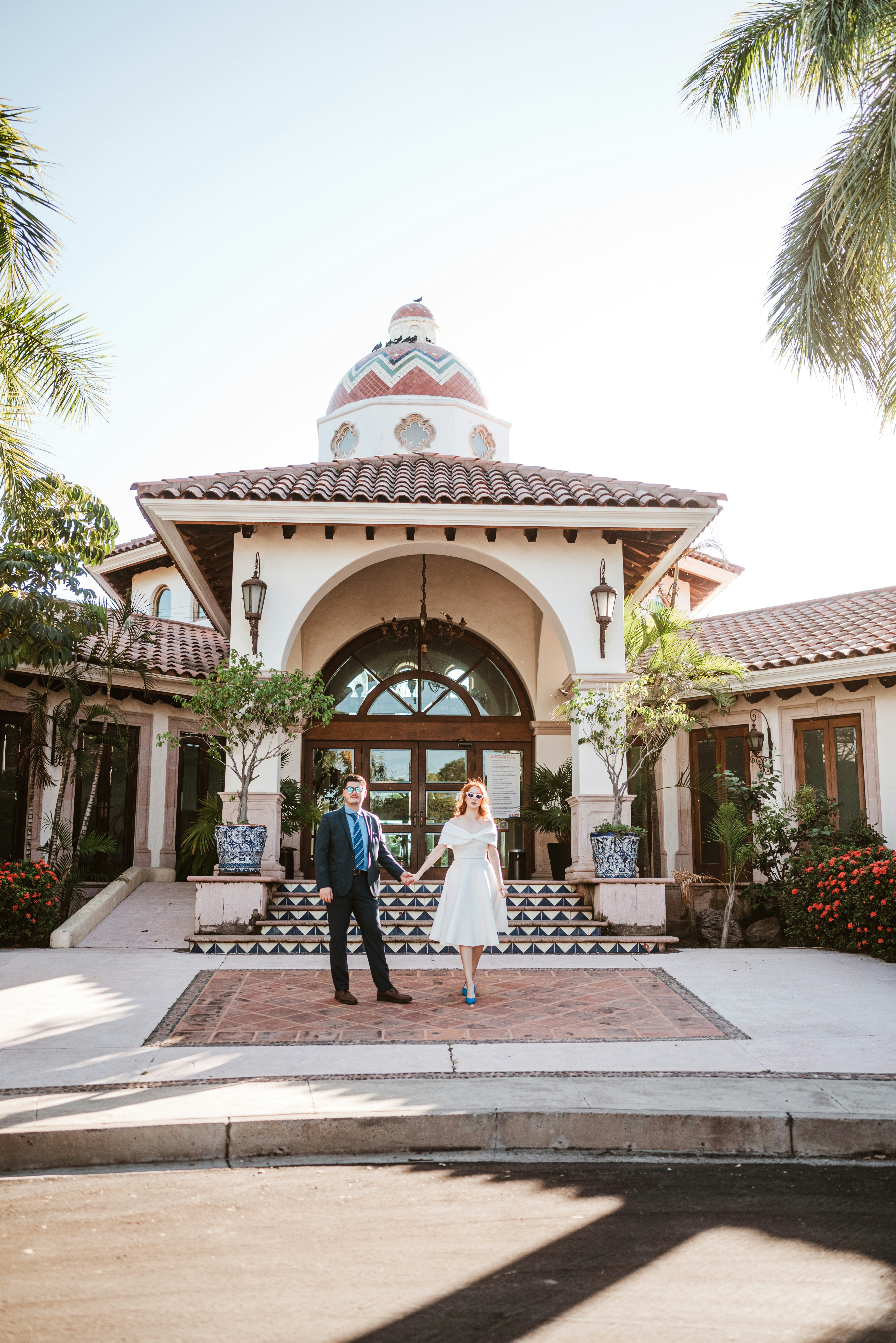 Couple at the Steps of a Mediterranean-Style Villa