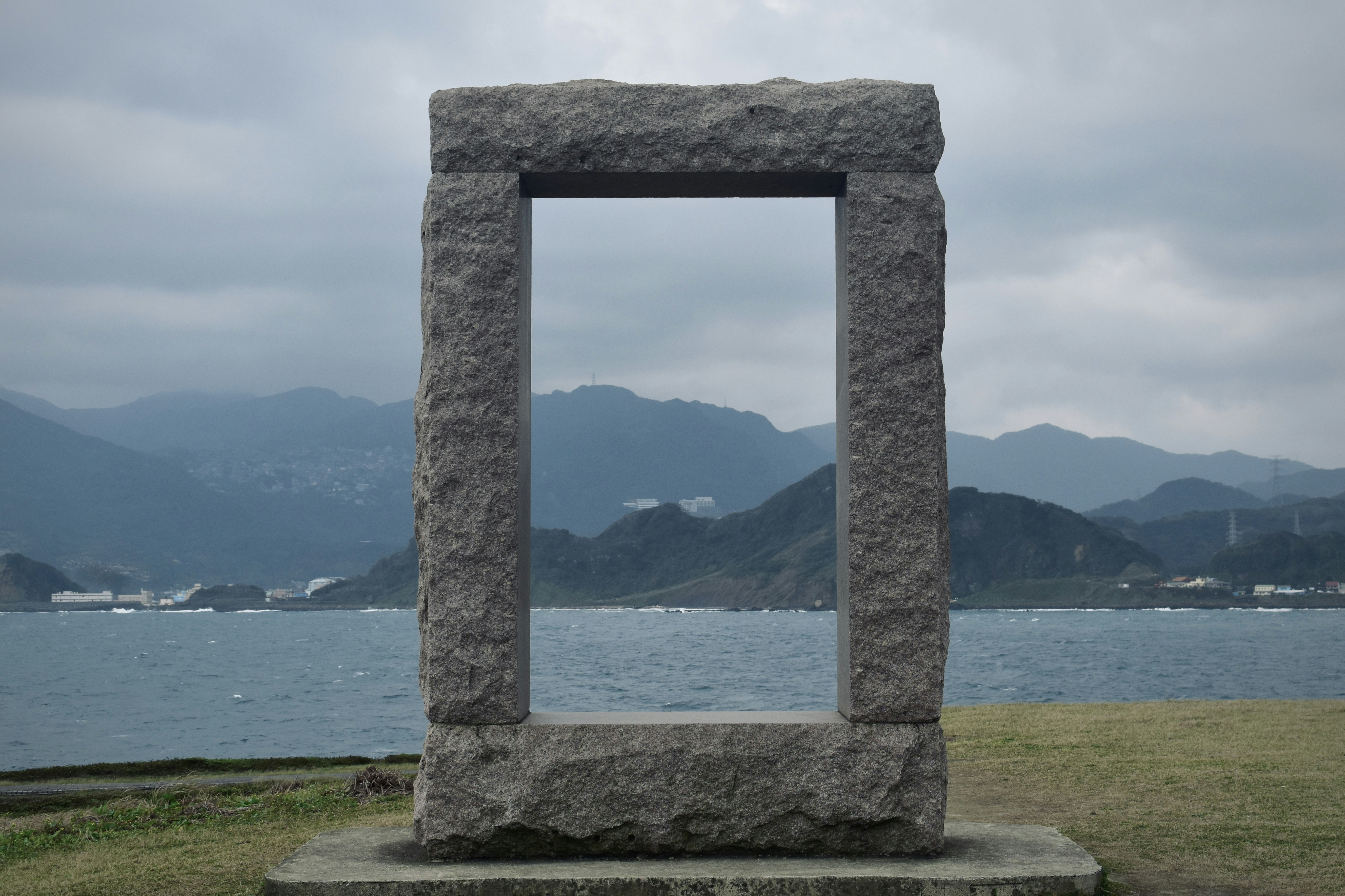 Framed by Stone: A Seascape Through a Monumental Window