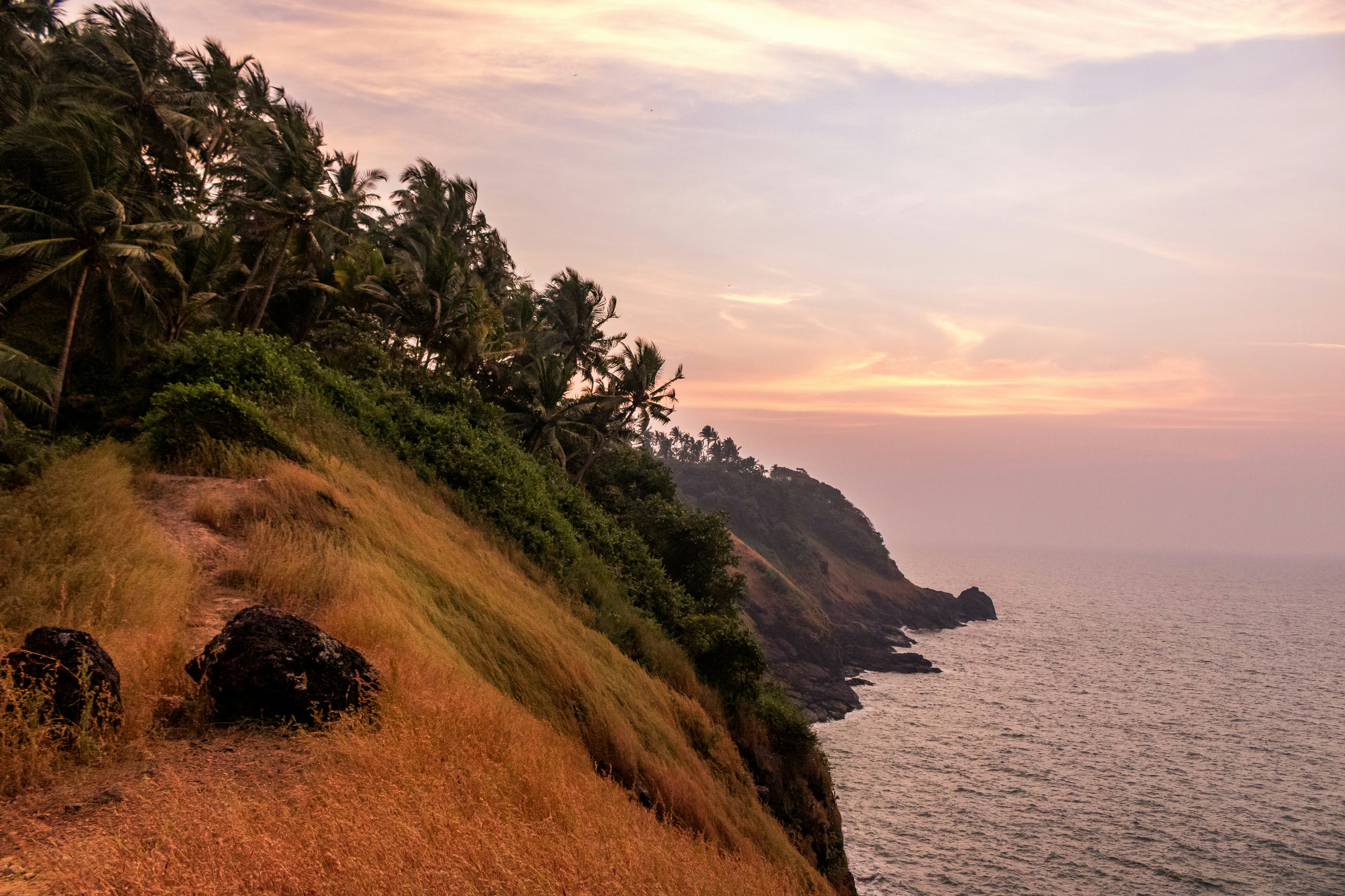Horizon Cliffs at Dusk: A Coastal Ridge Reaches the Sea
