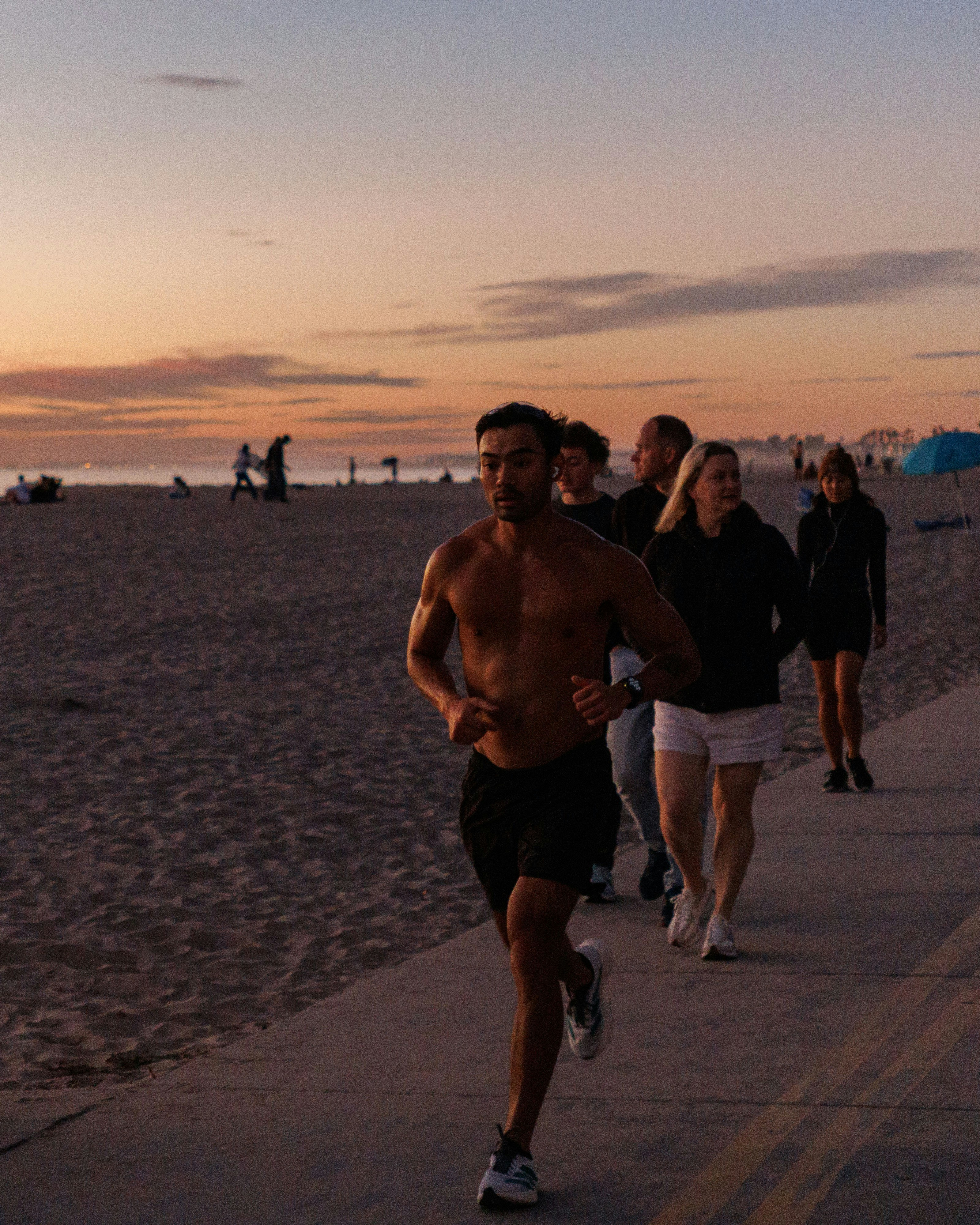 Central Runner on a Sunset Beach Promenade