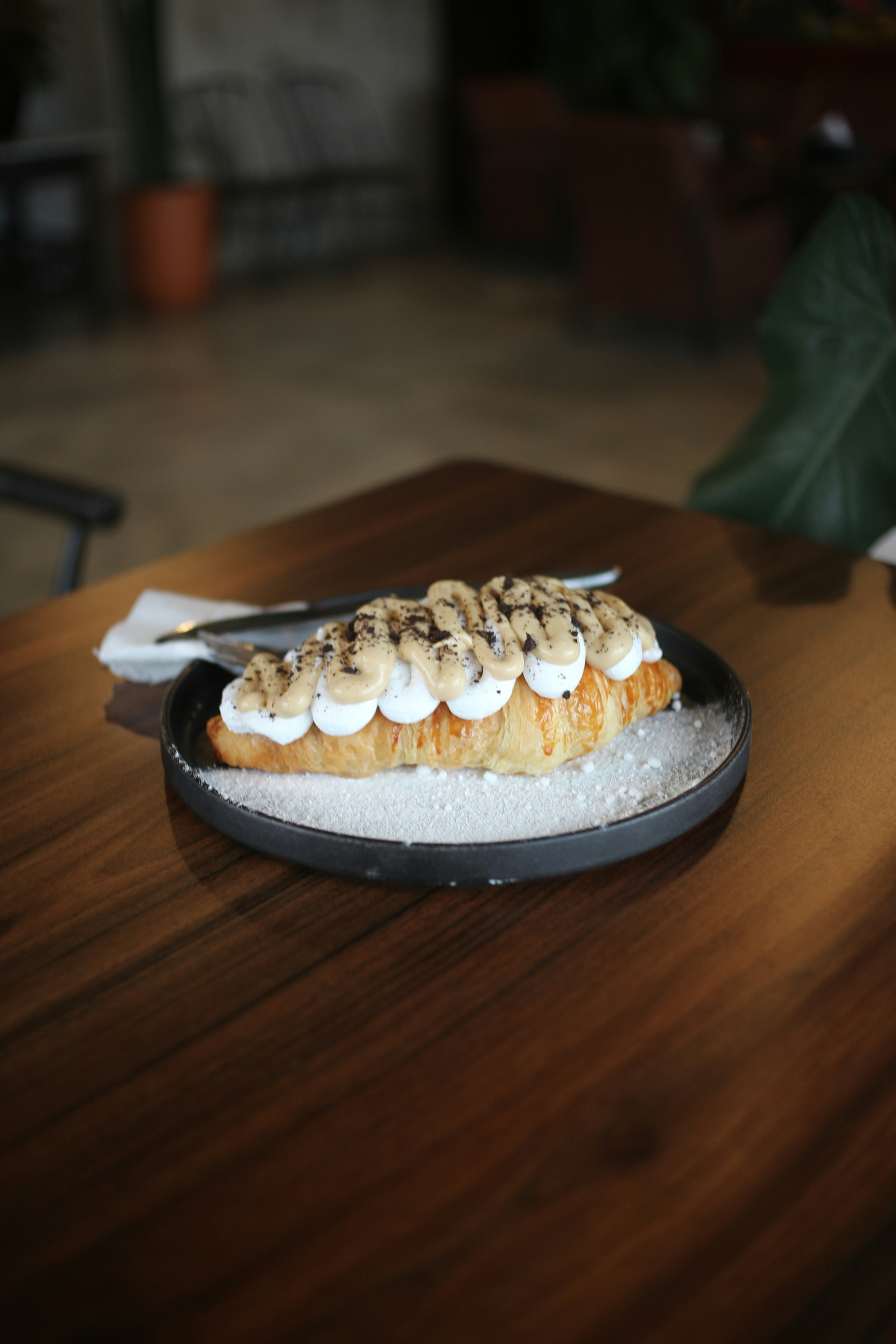 Creamy Dusted Pastry On a Cozy Café Table
