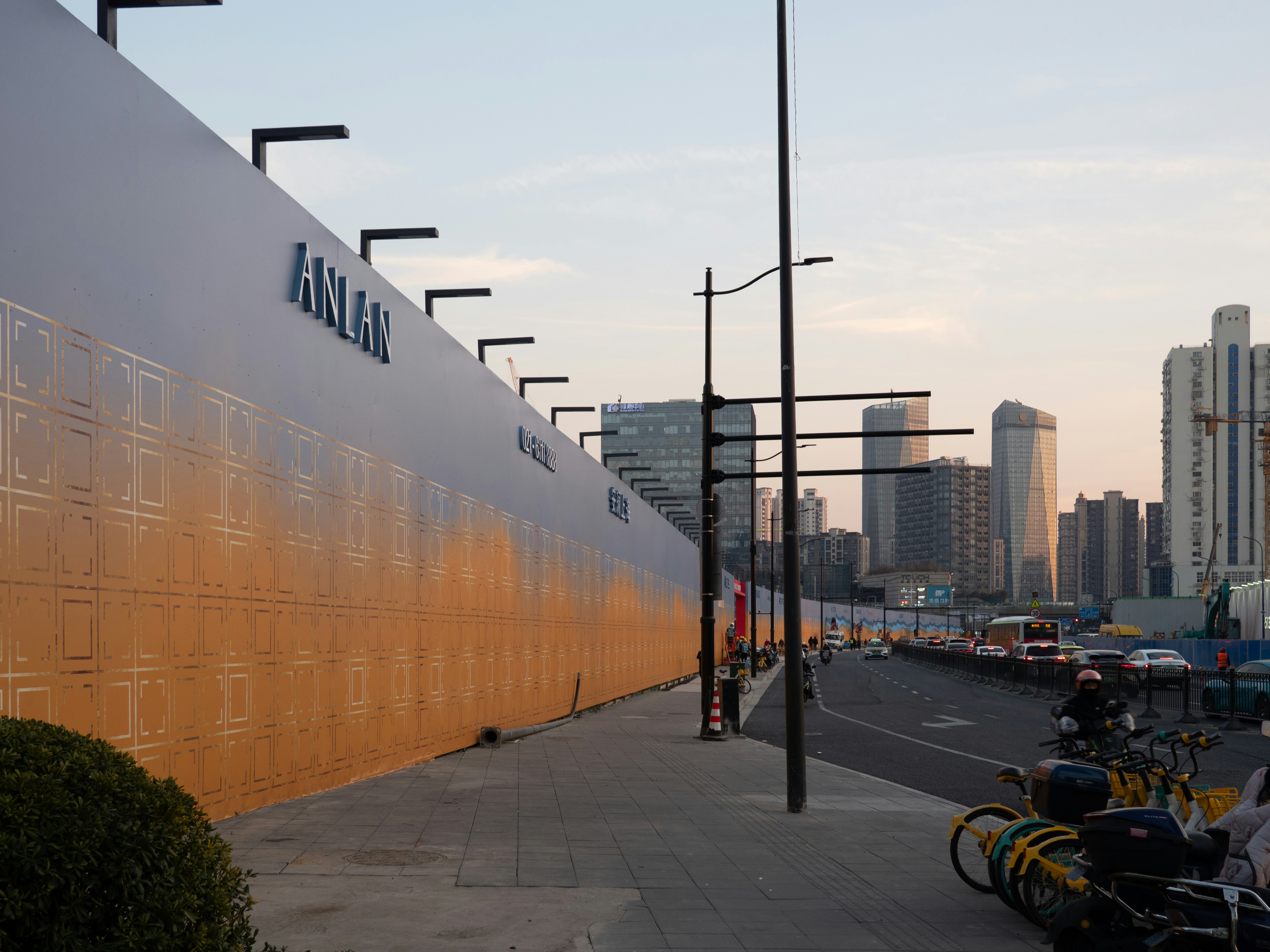 Sunlit Promenade by the Glassy Waterfront