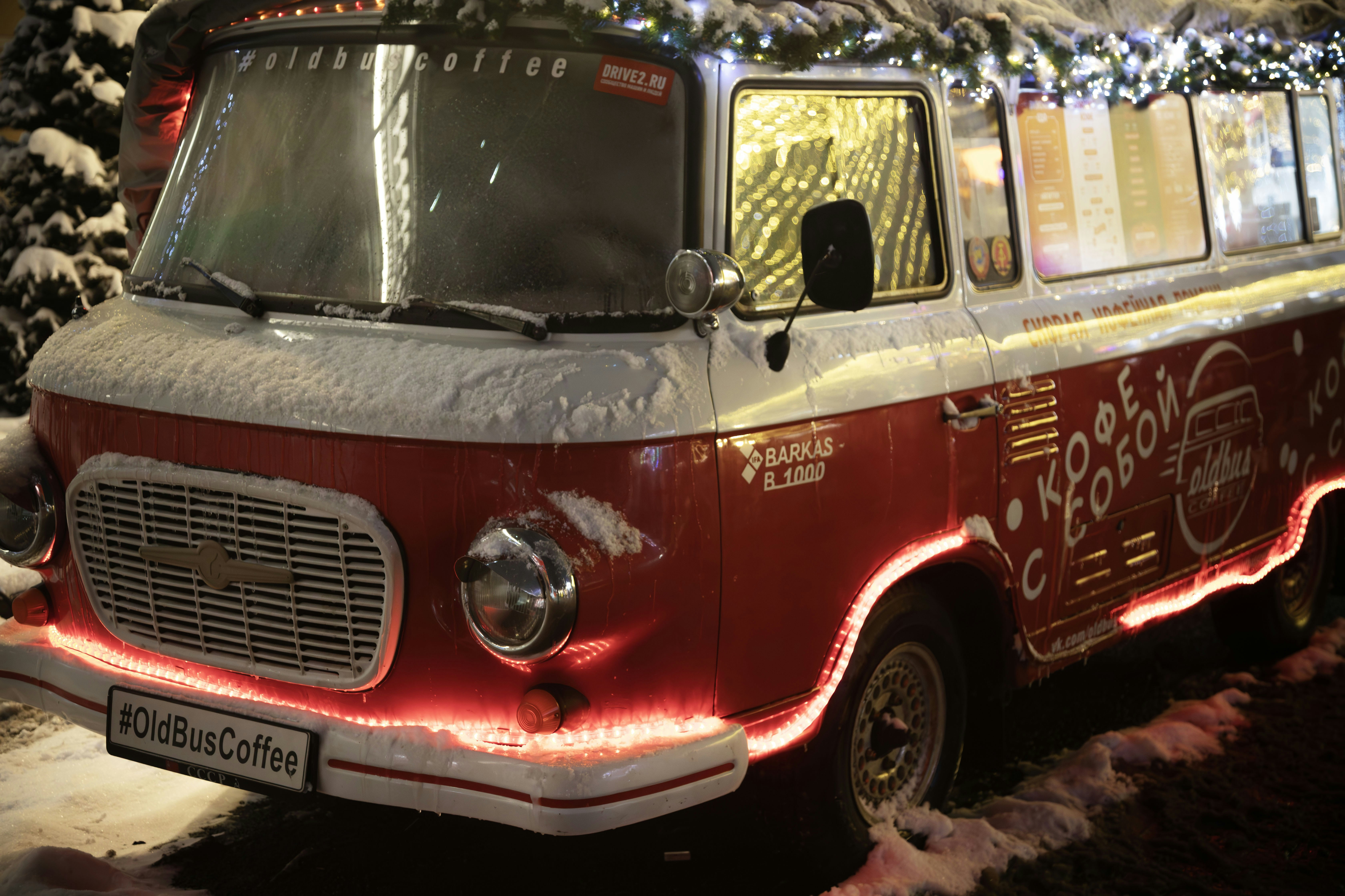 Snow-kissed vintage van with glowing undercarriage lights
