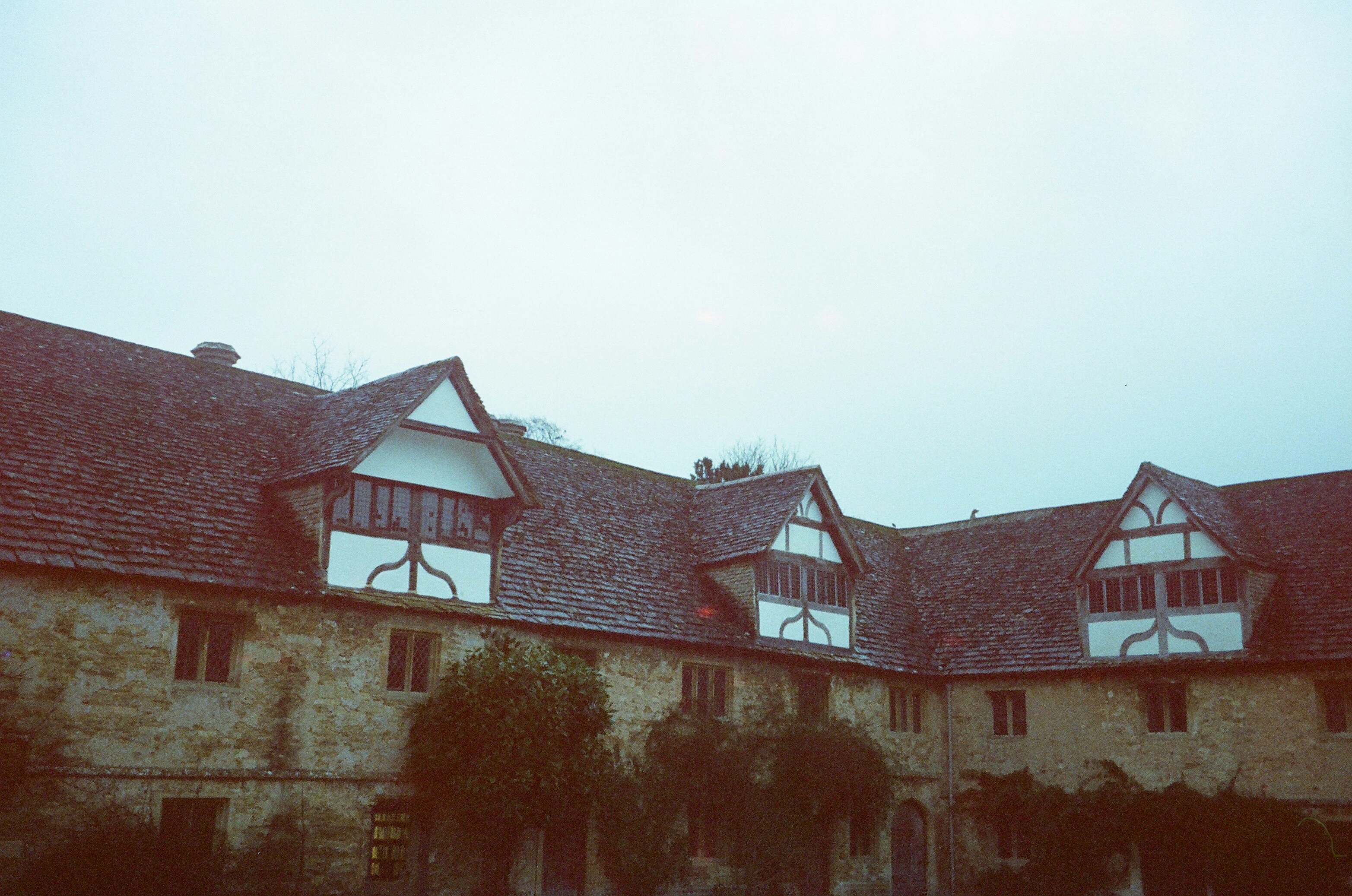 Tudor style building with dormer windows and timber framing photo ...