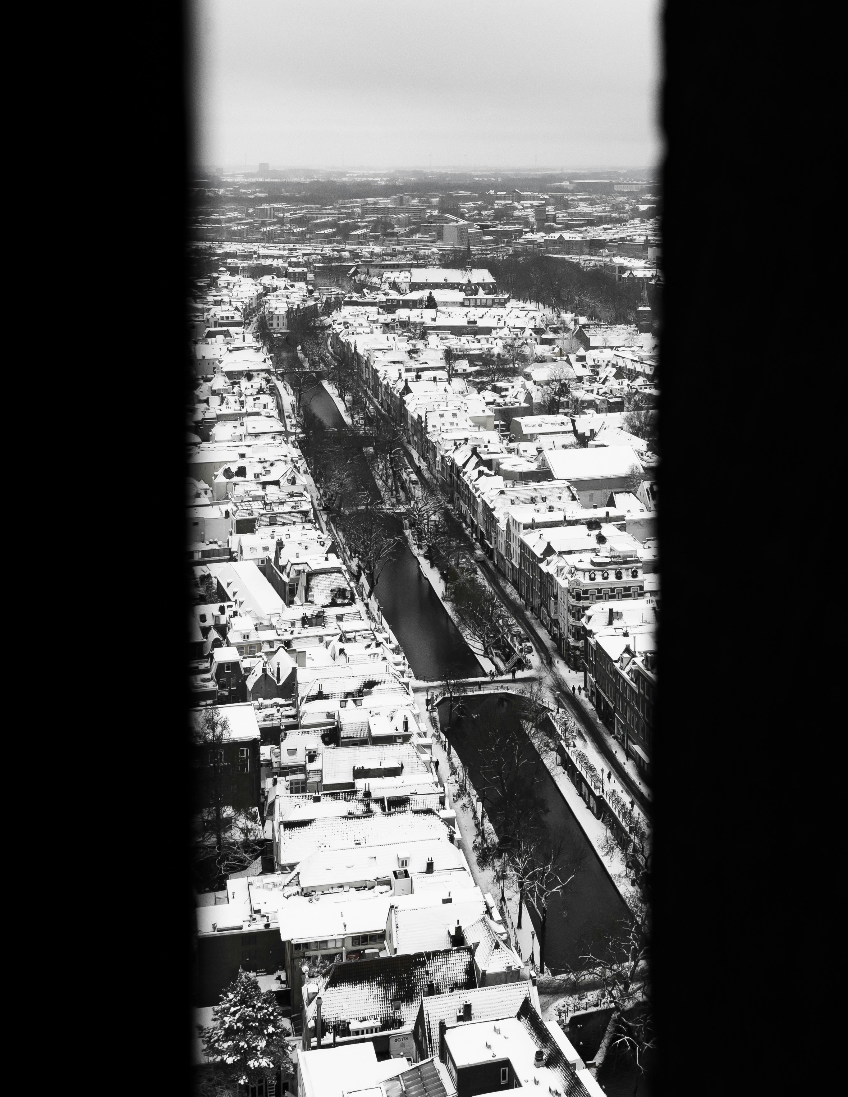 Vertical Deserted Canal: Aerial Snowy Streetcar Canyon