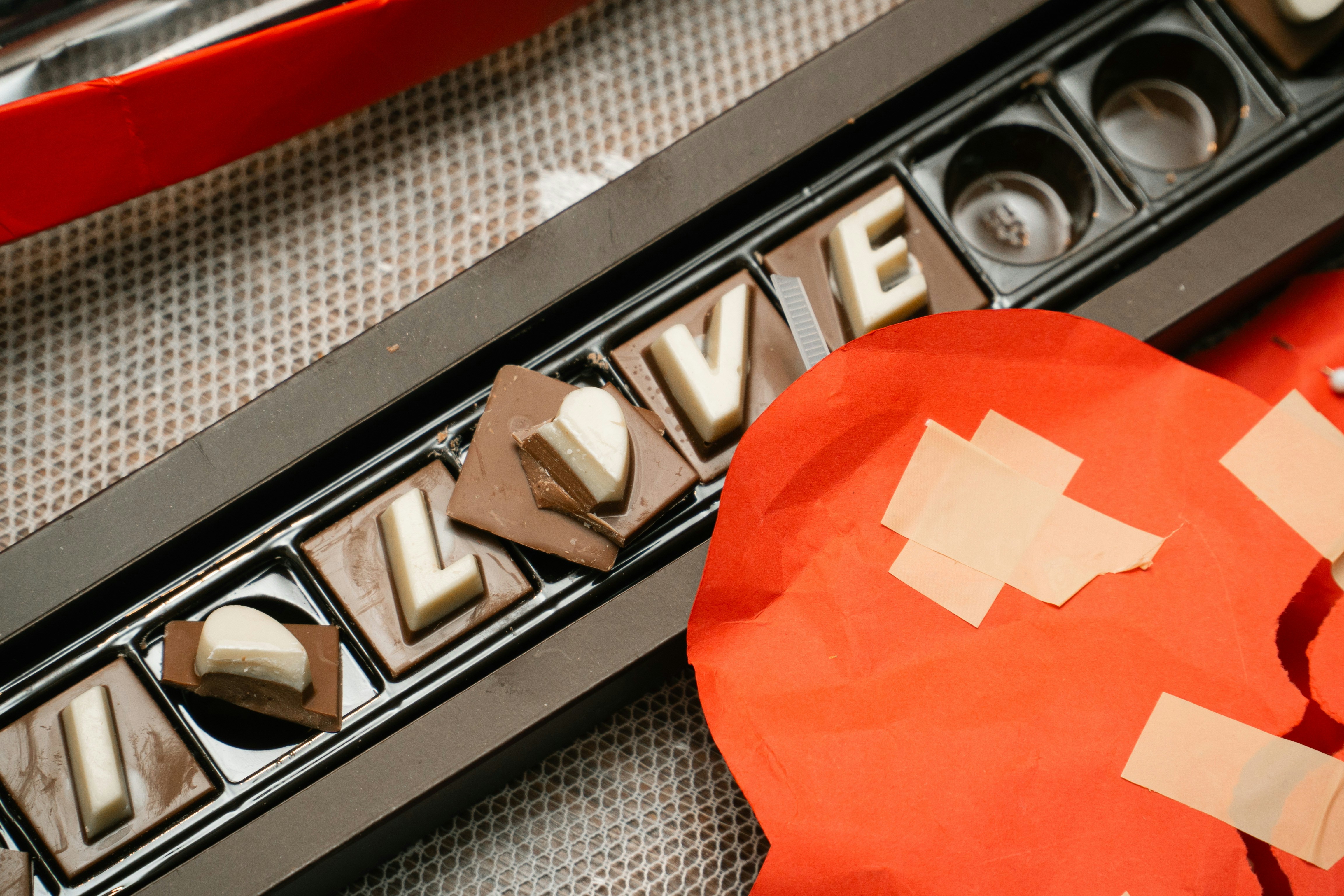 Sticker-Scattered Love: A Close-Up on a Retro Keyboard with Red Heart