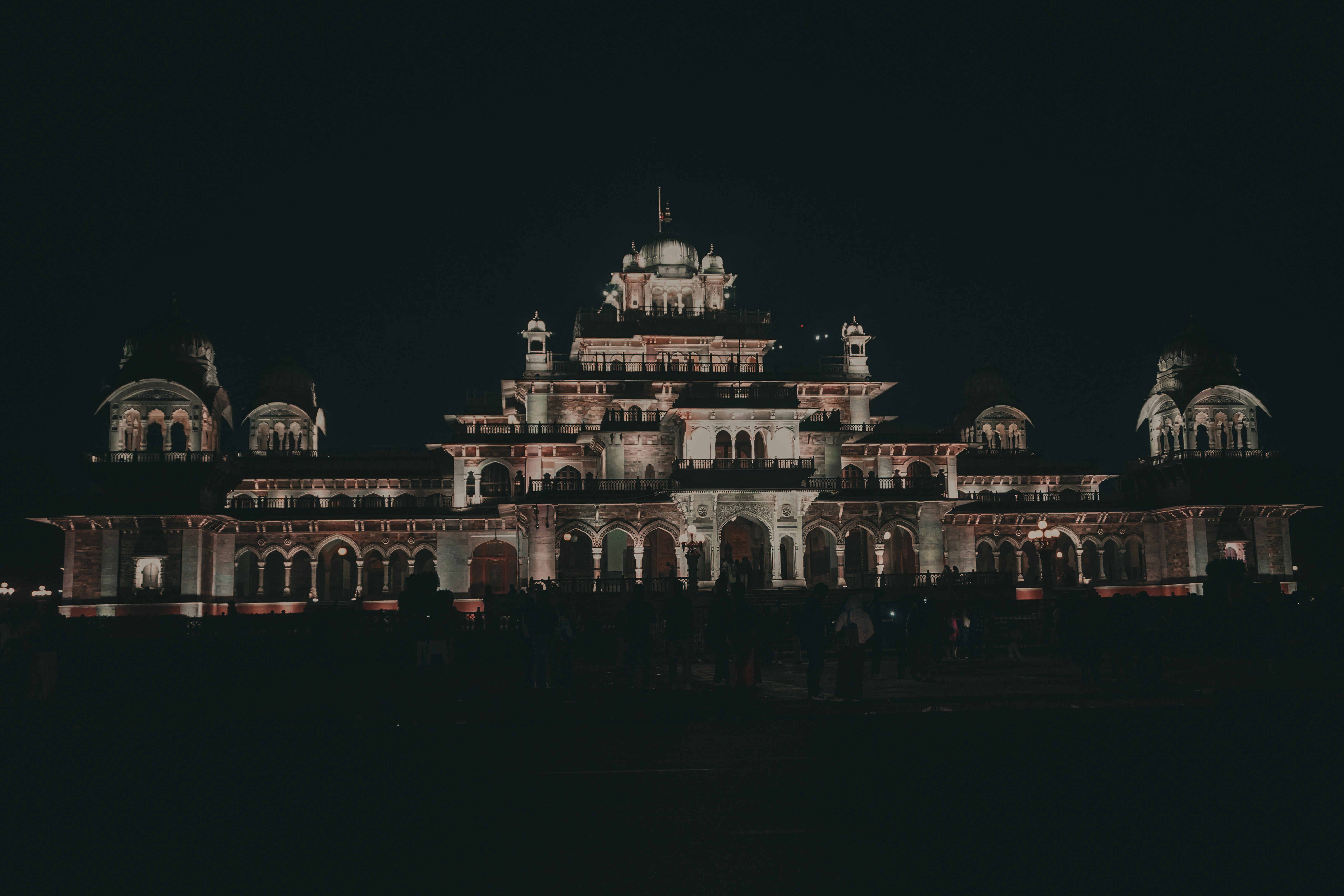 Moonlit Pavilion: An Illumined Fortress Rising from the Dark