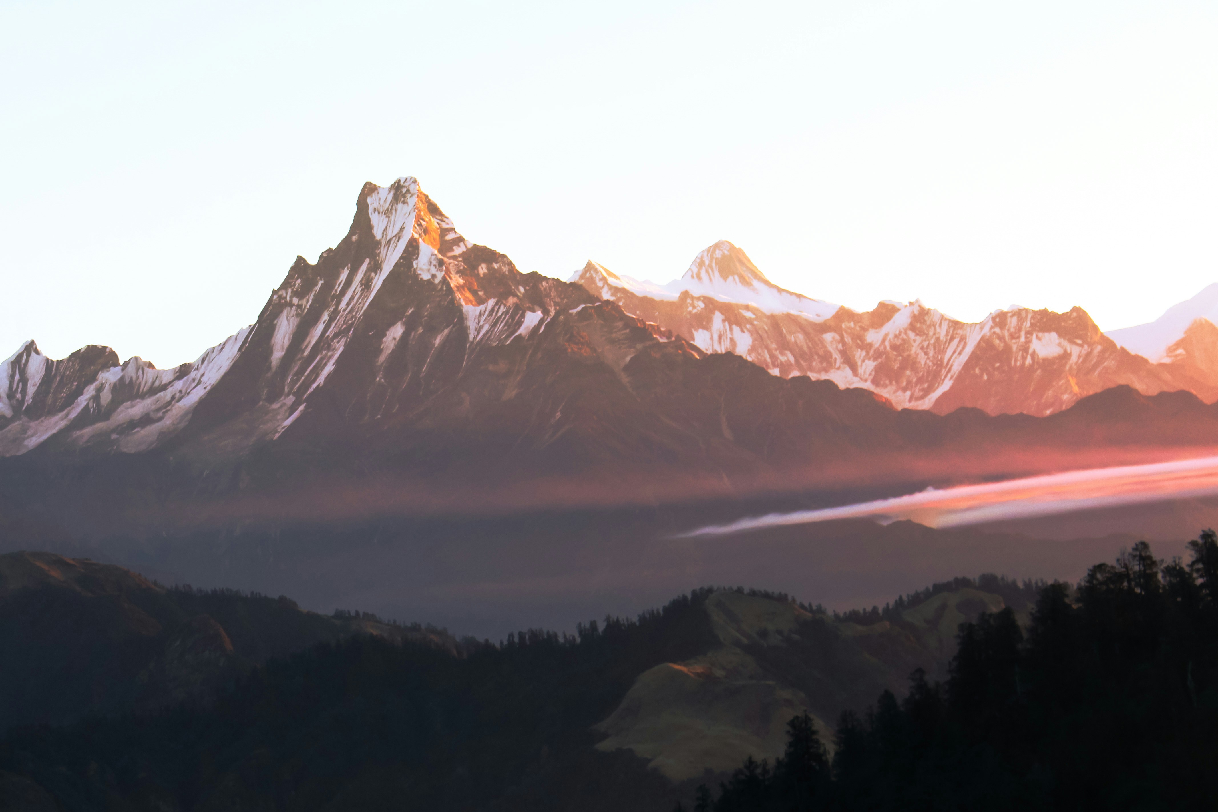 Dawn Over jagged peaks: a quiet valley wakes beneath pale alpenglow