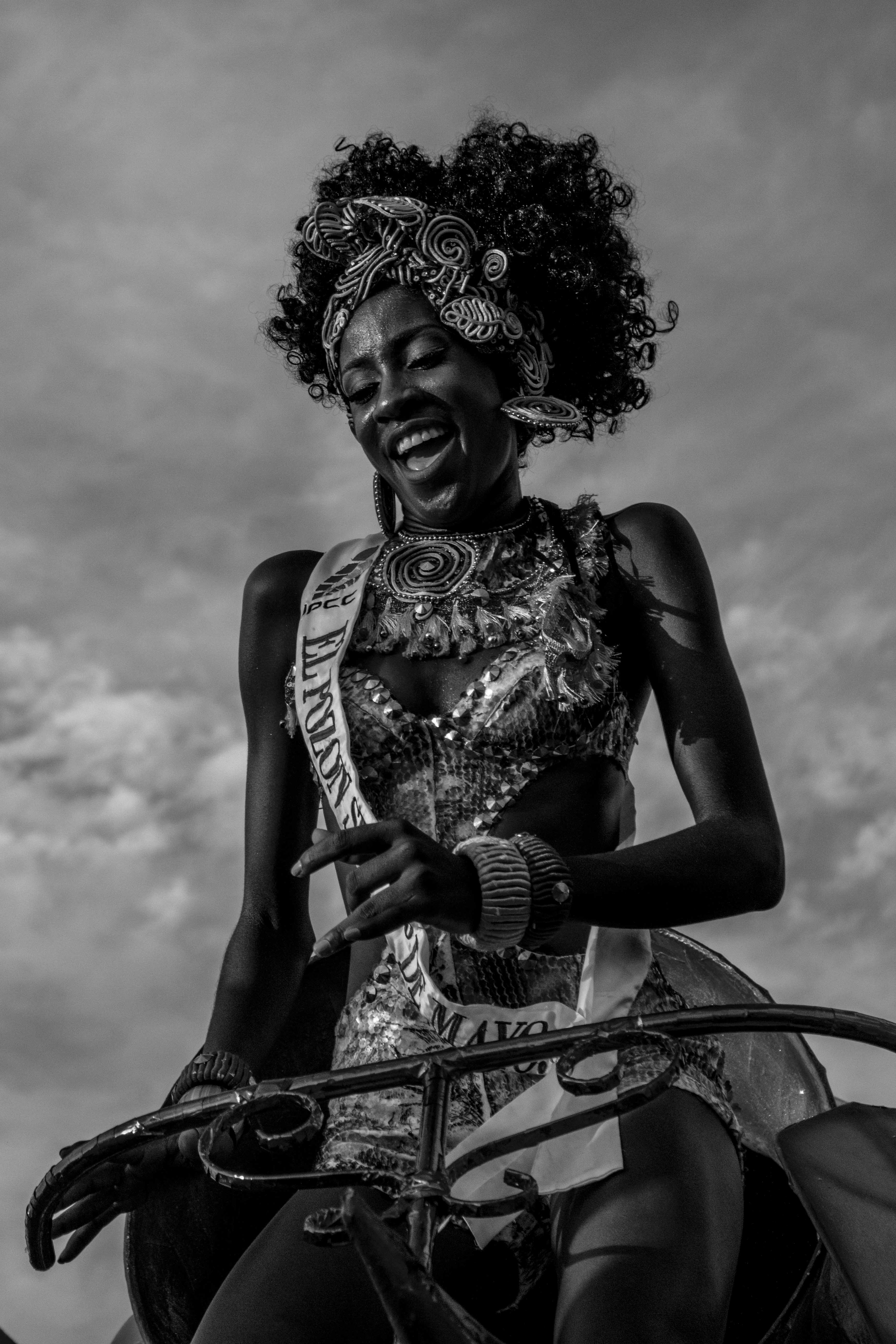 Joy in Motion: A Carnival Queen Rises Above the Crowd