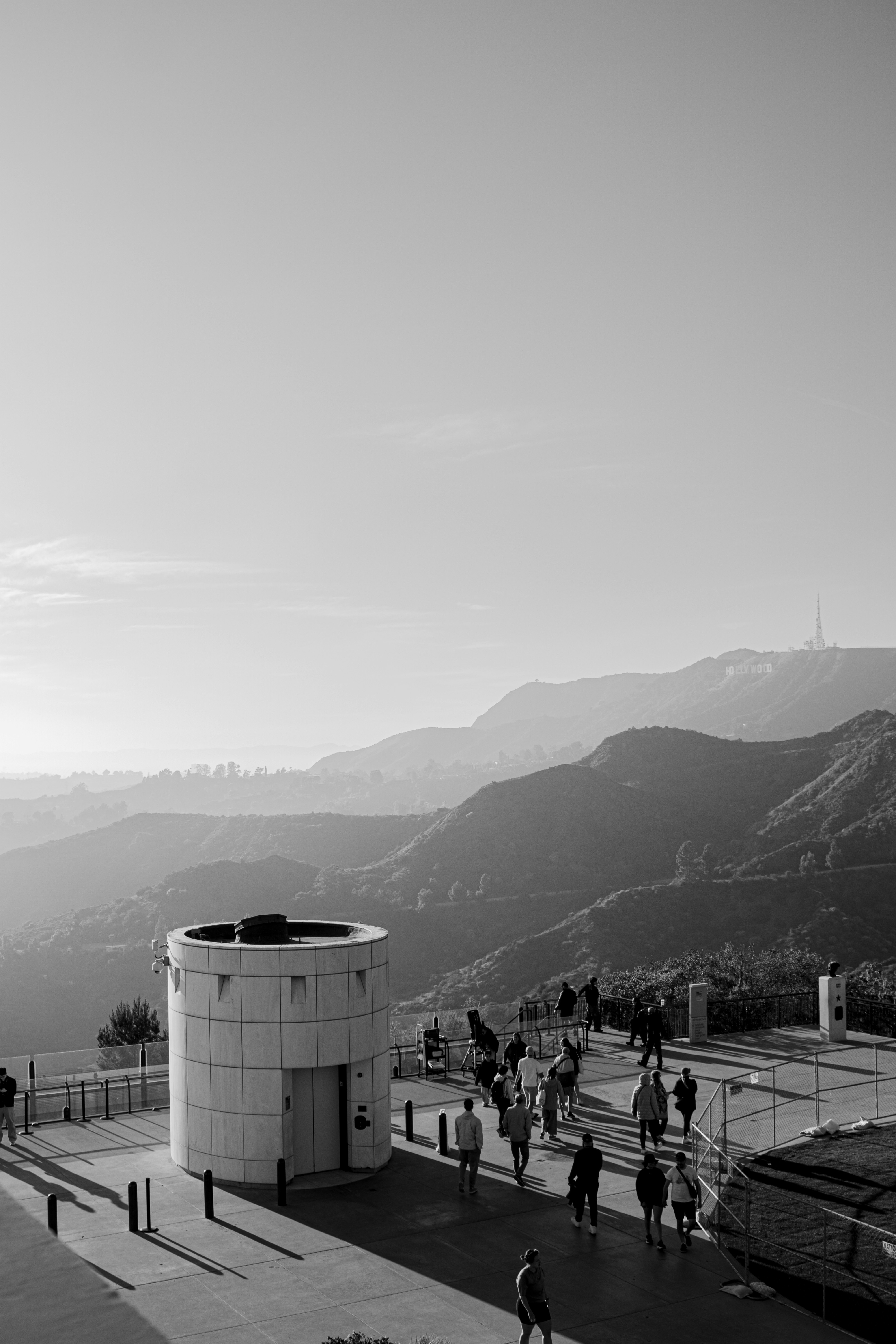 Observation Deck Vista: Silhouettes Against a Misty Ridge