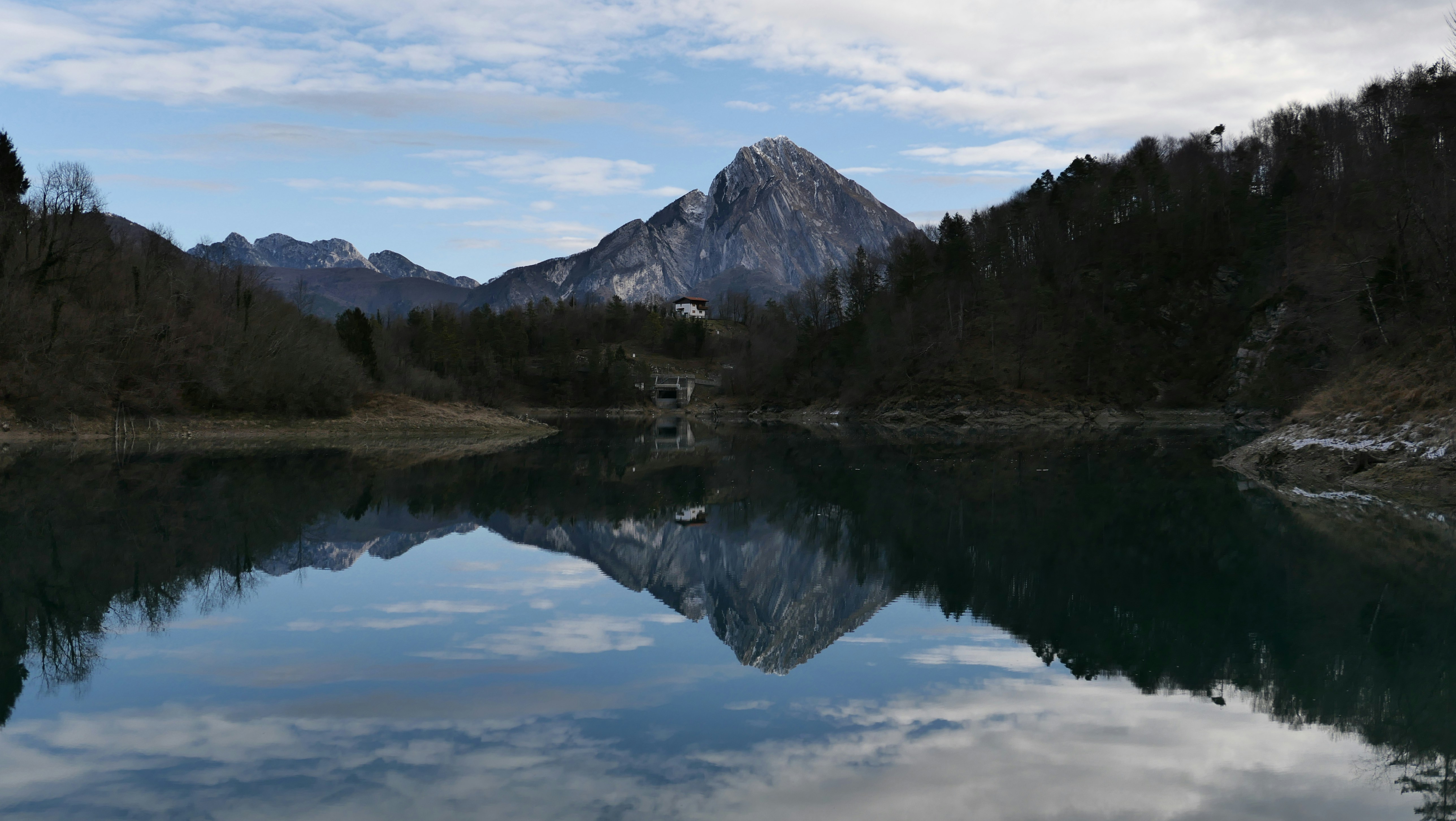 Mirror Peak: Silent Lake Reflecting a Jagged Horizon
