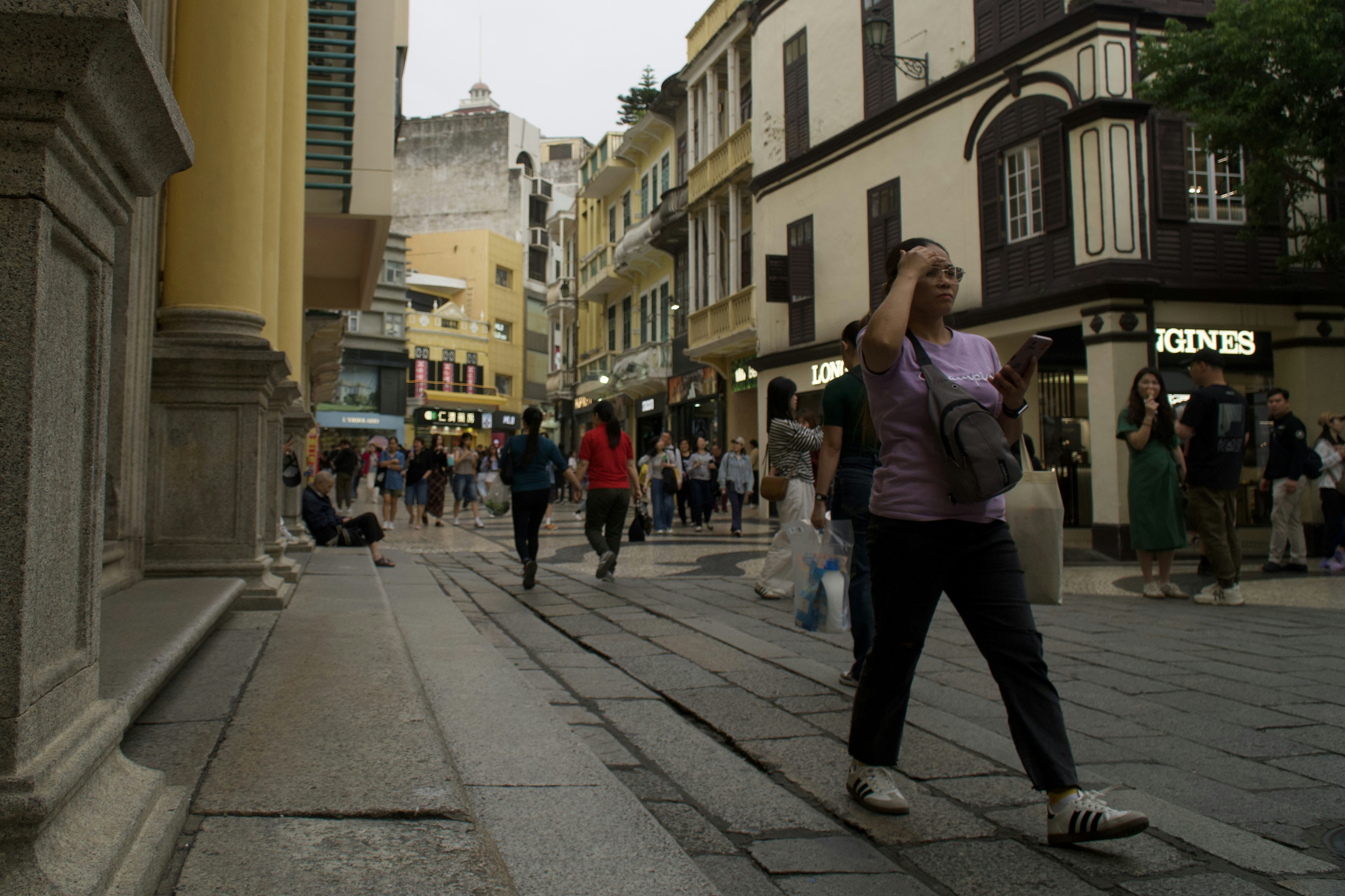 Pedestrian Portrait Amid a European Street Corridor