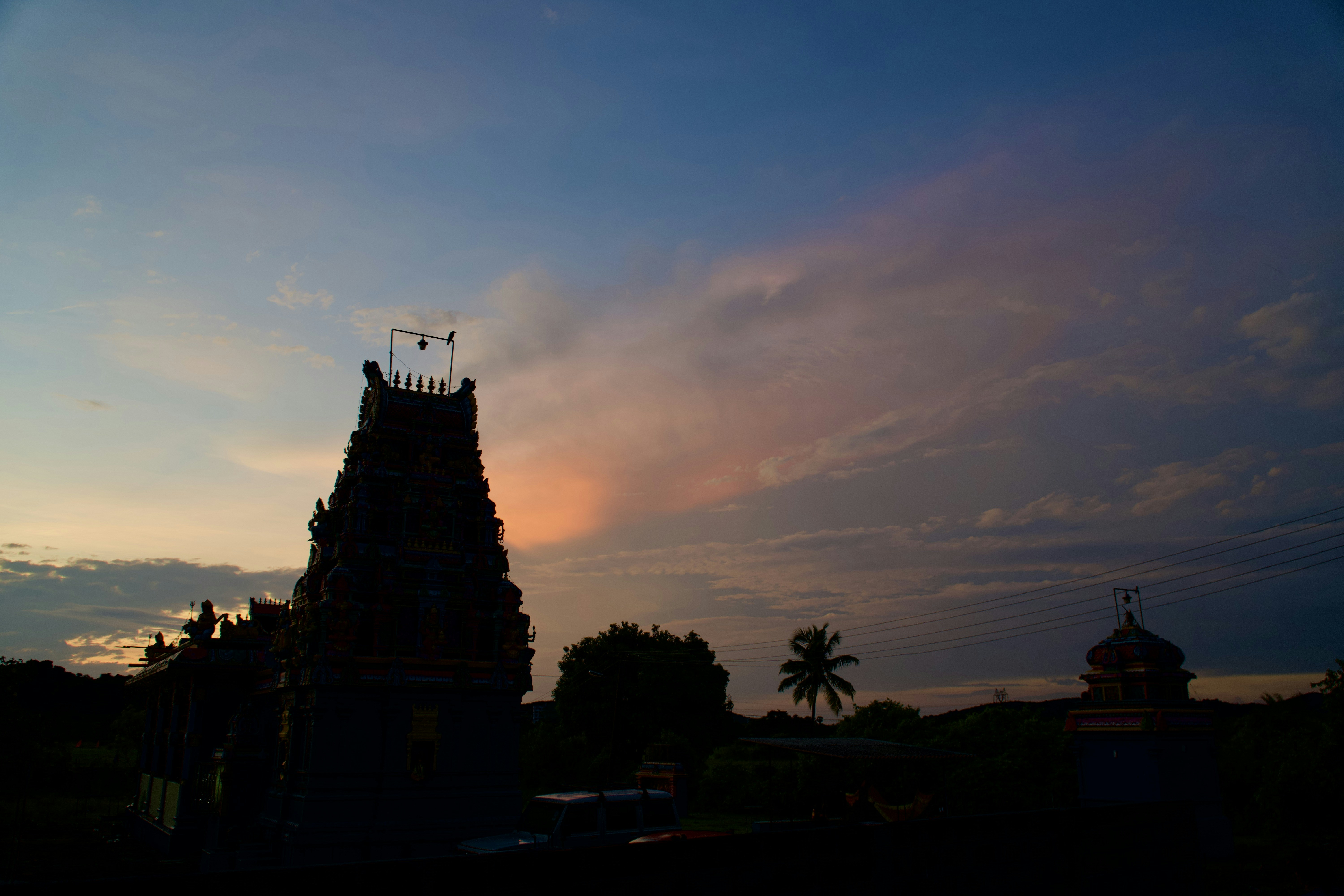 Silhouetted Temple Spire Against Dusk Sky