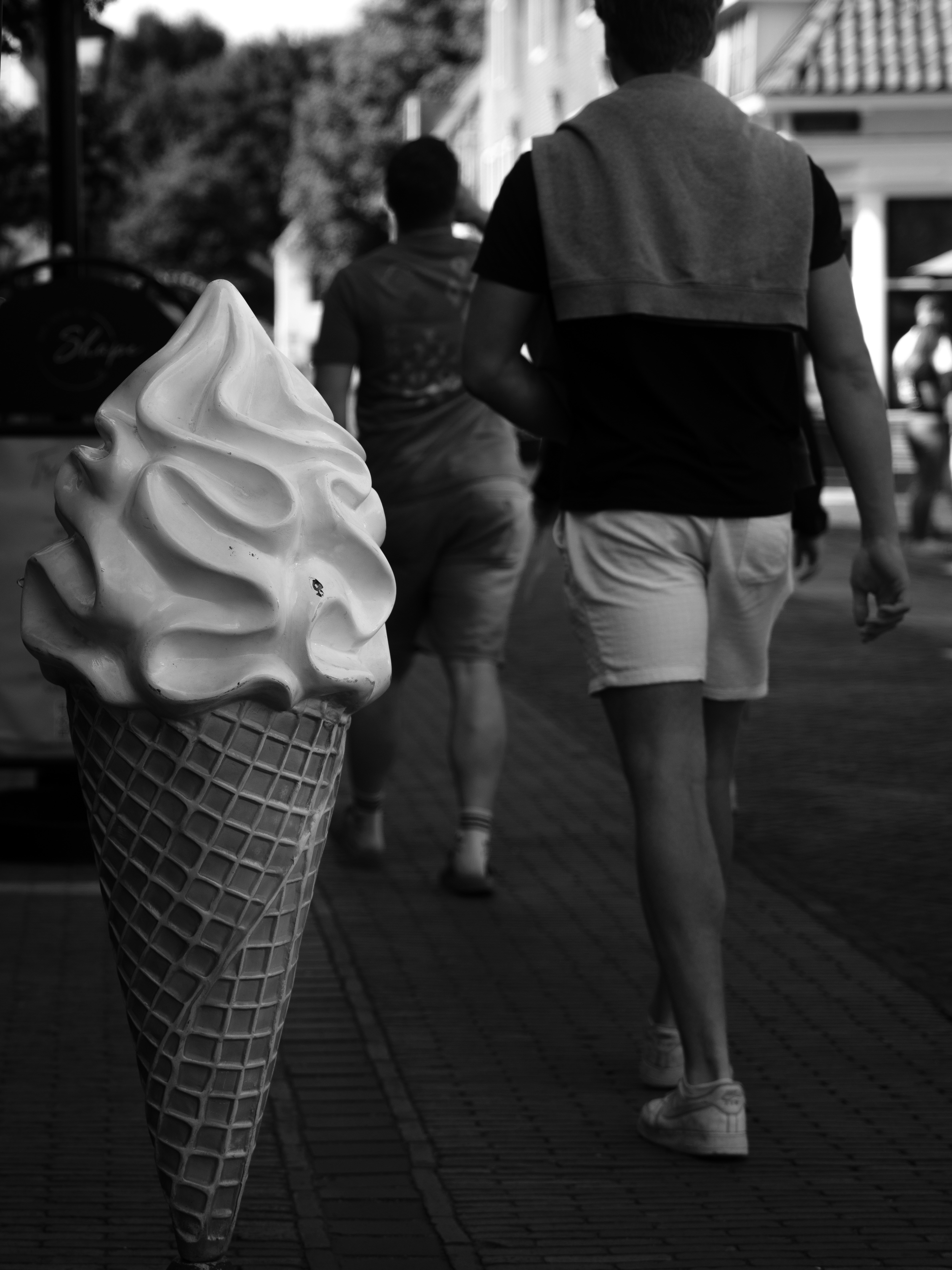 Ice Cream Paradox: A Street Scene in Silhouetted Monochrome