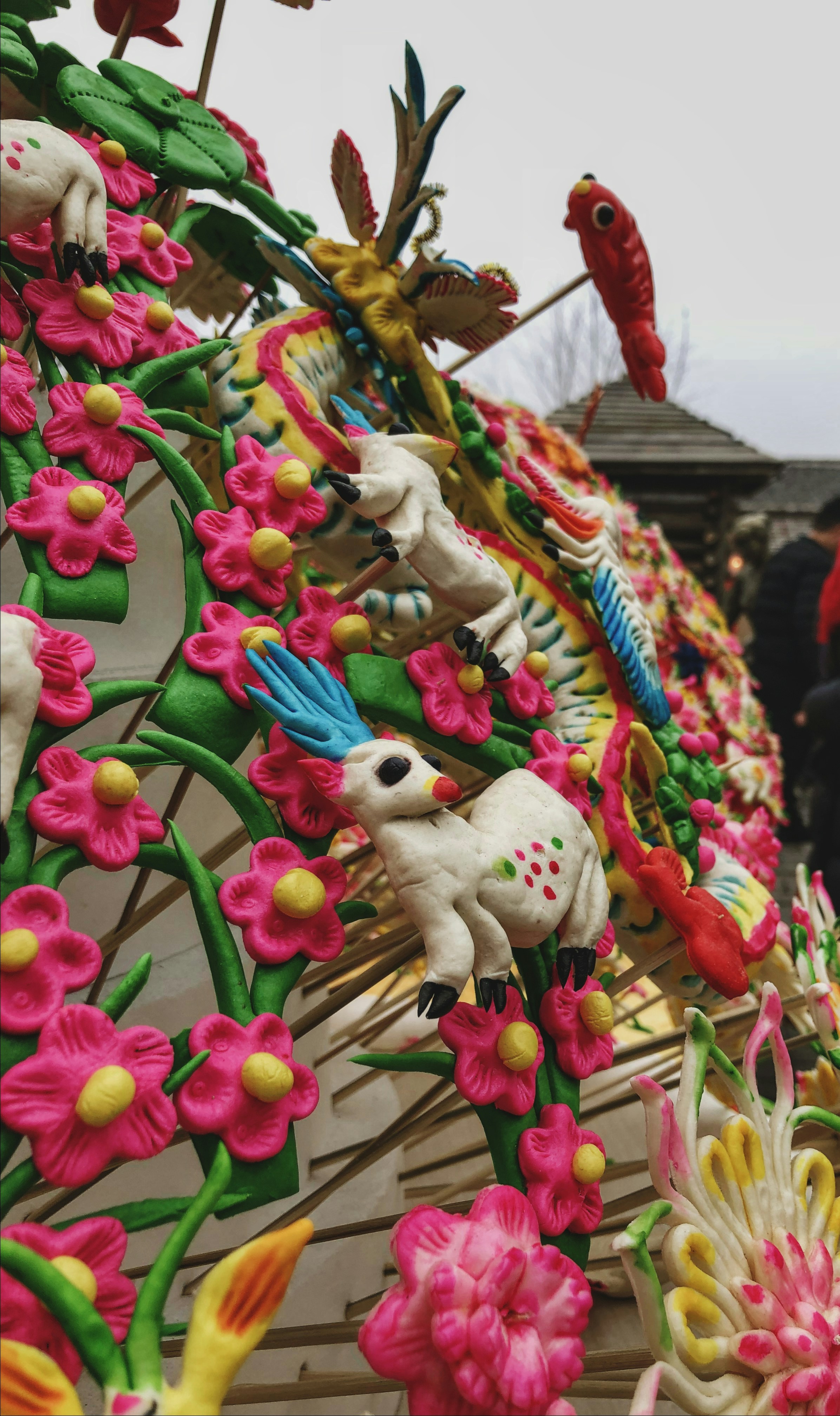 Vibrant Festival Parade: Floral Dragon and Plush Beasts Cascade