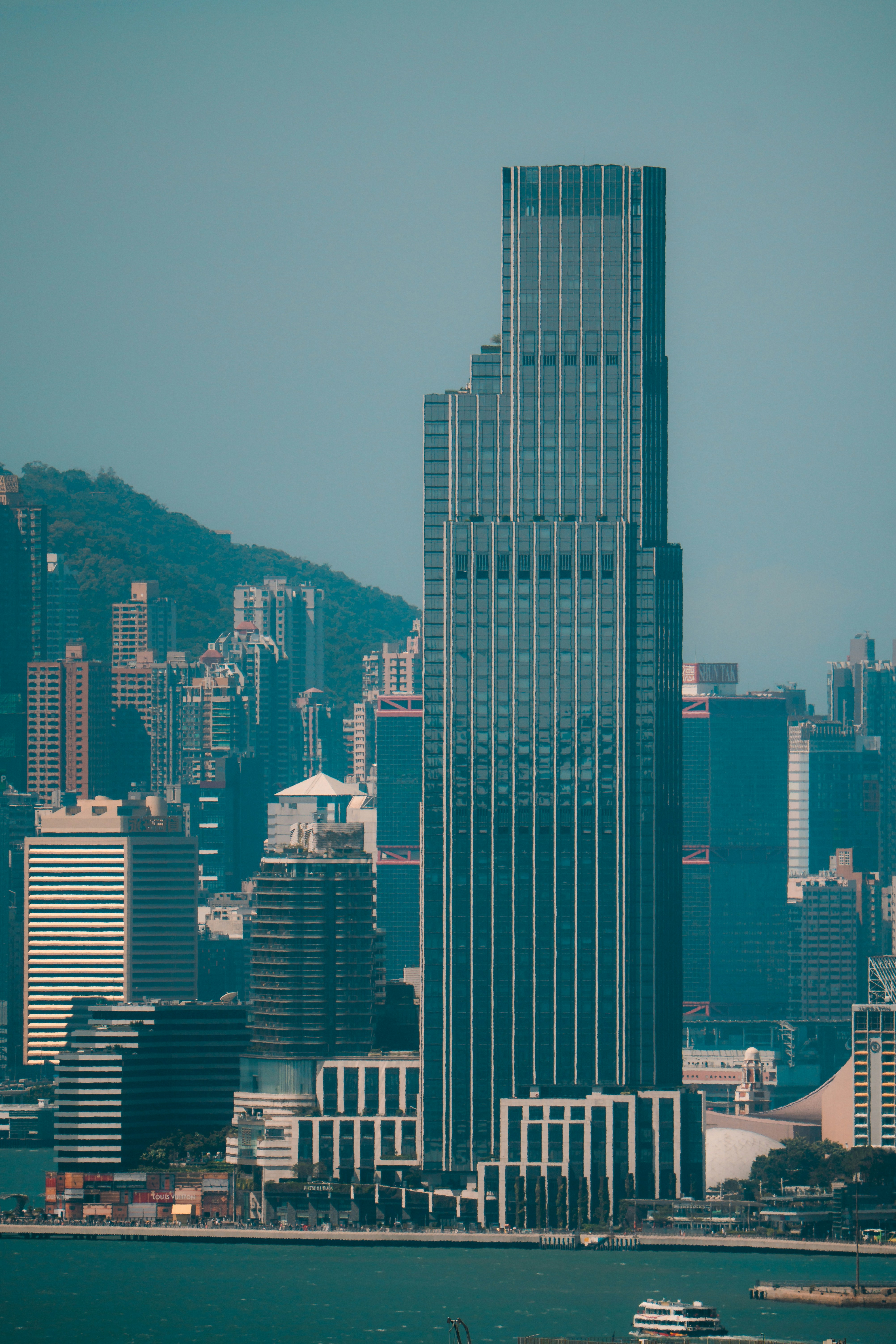 Towering Glass Spine Among a Sea of Steel