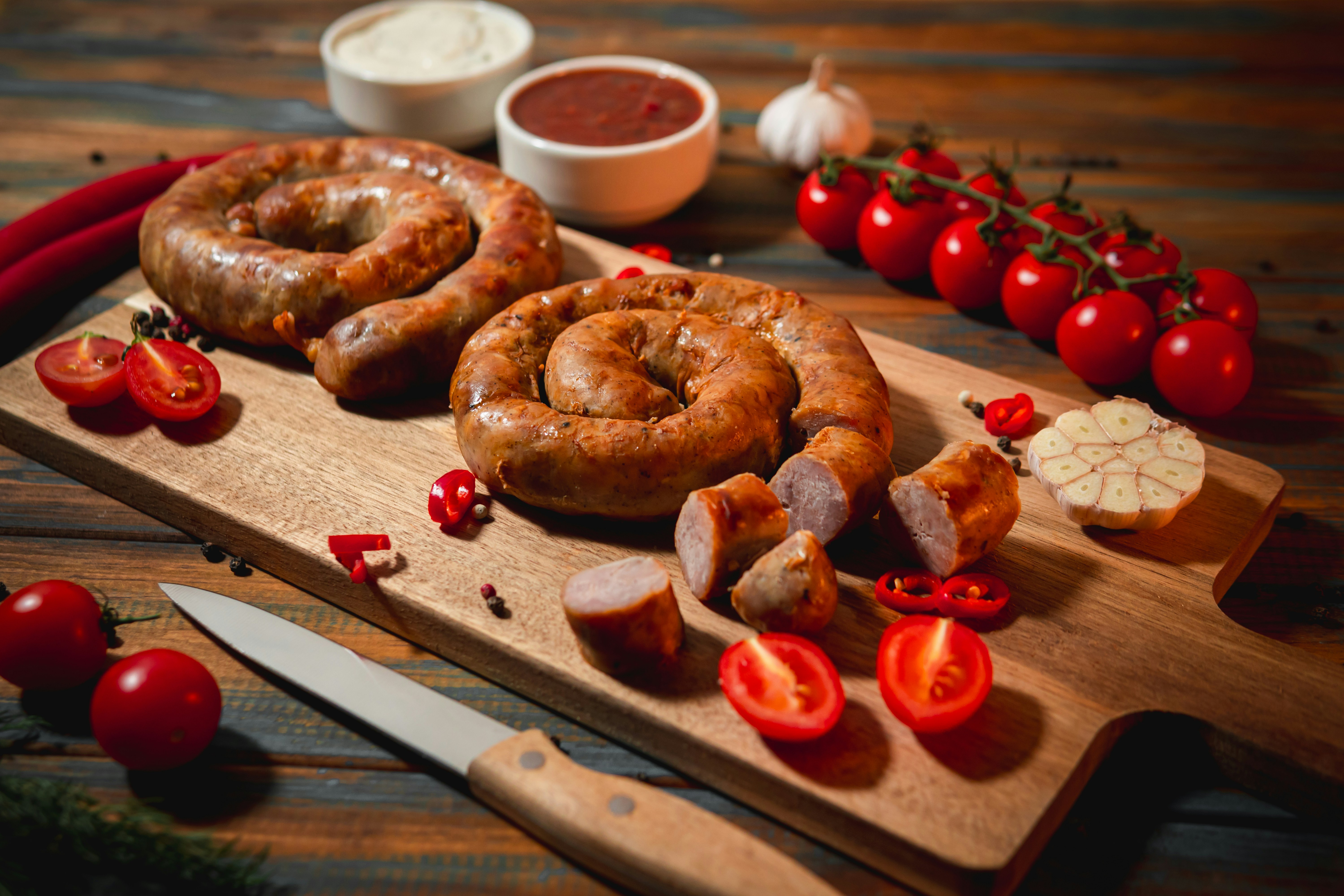 Sizzling Sausages on a Rustic Cutting Board