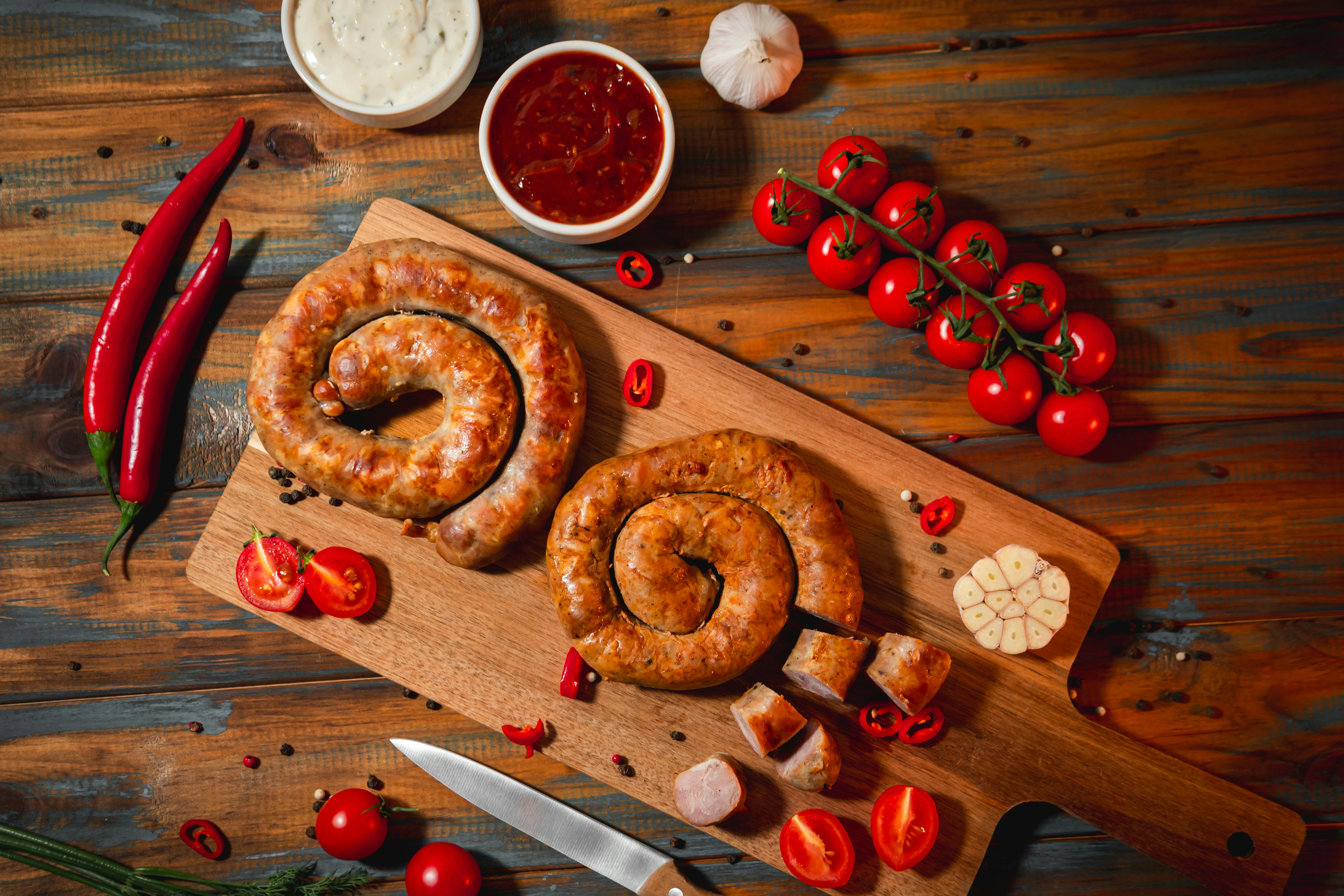 Coiled Pastries on a Rustic Board with Cherry Tomatoes and Dips