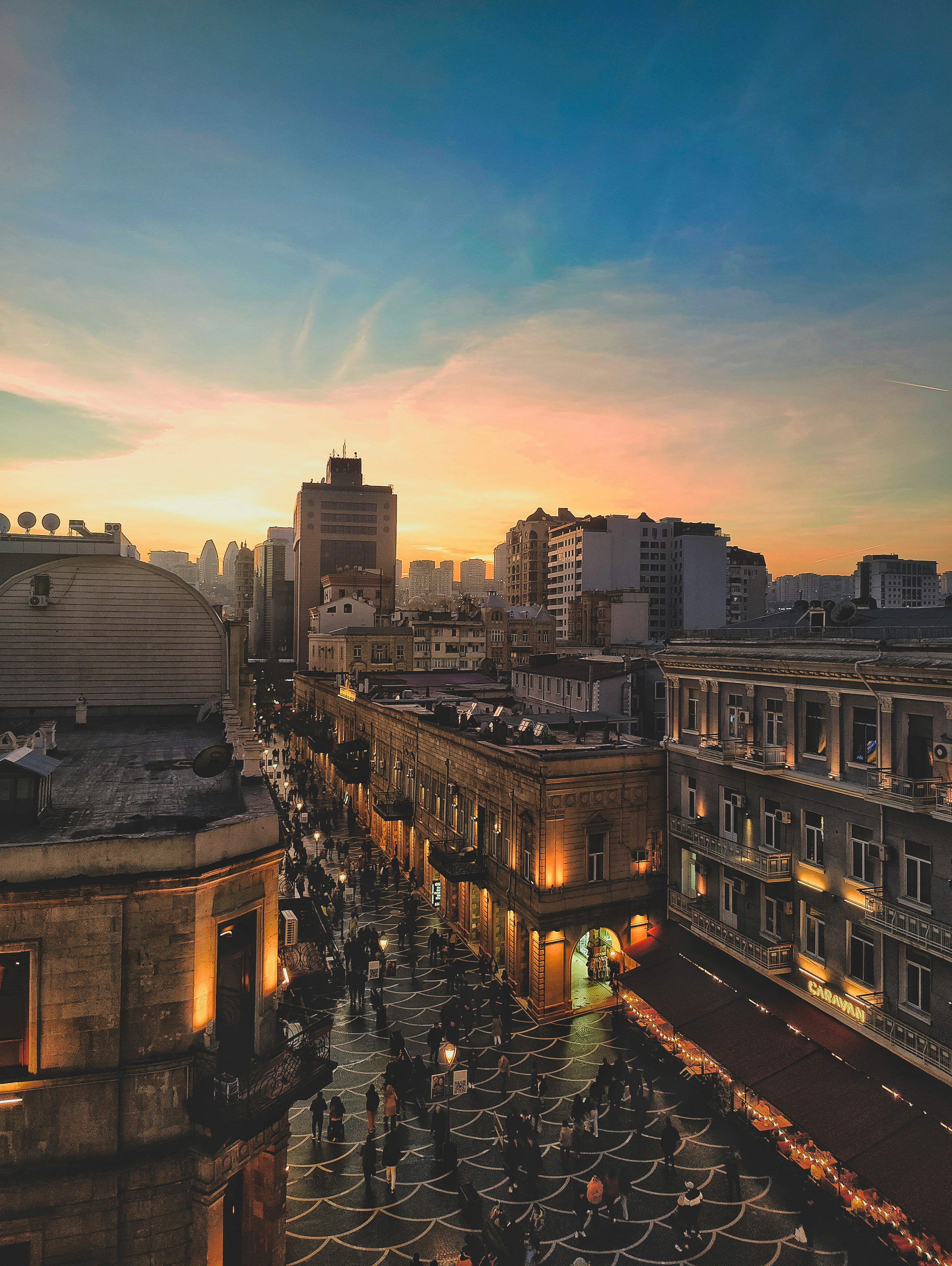 City street with people at sunset