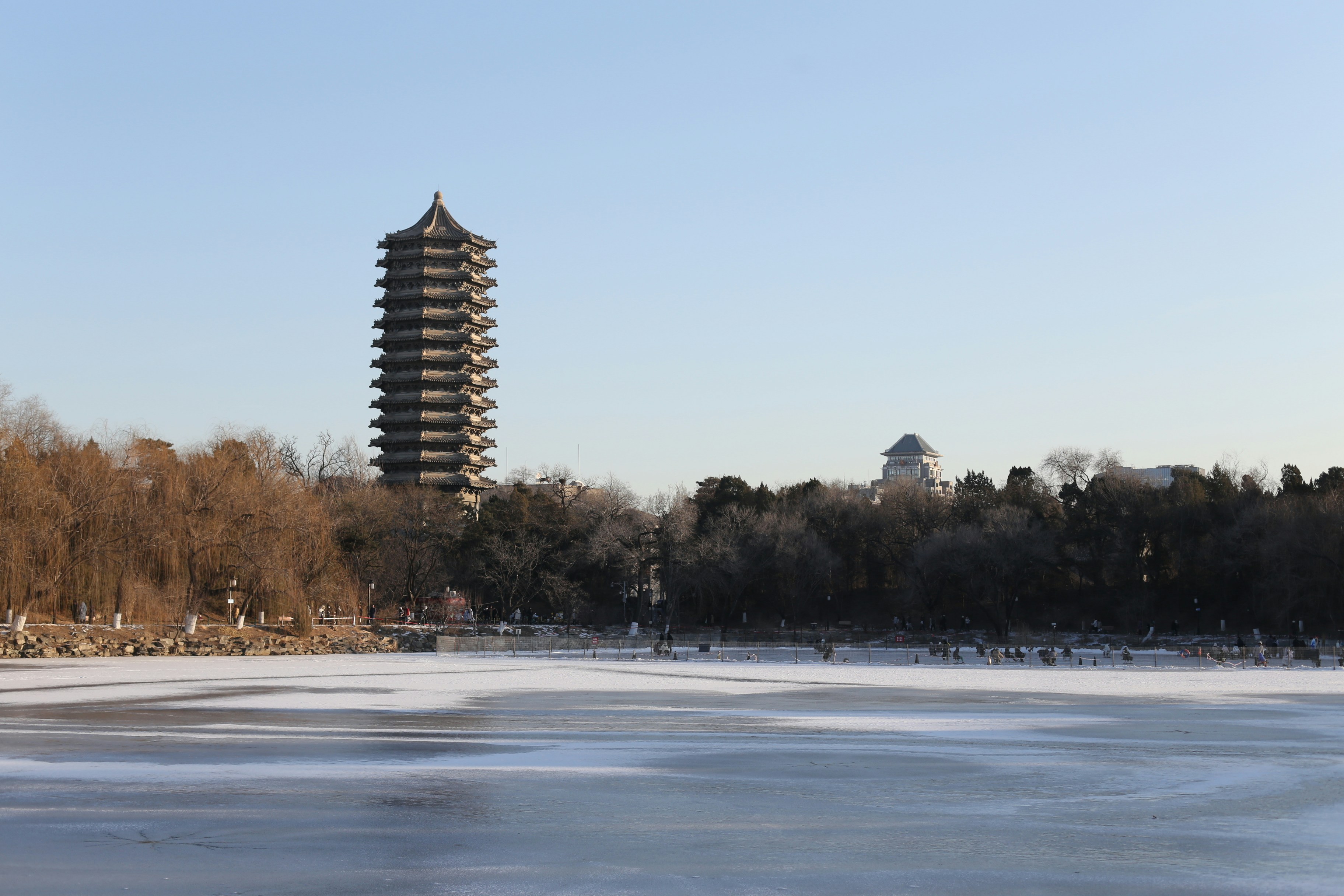 The Lanterned Tower Over a Quiet Winter Bank