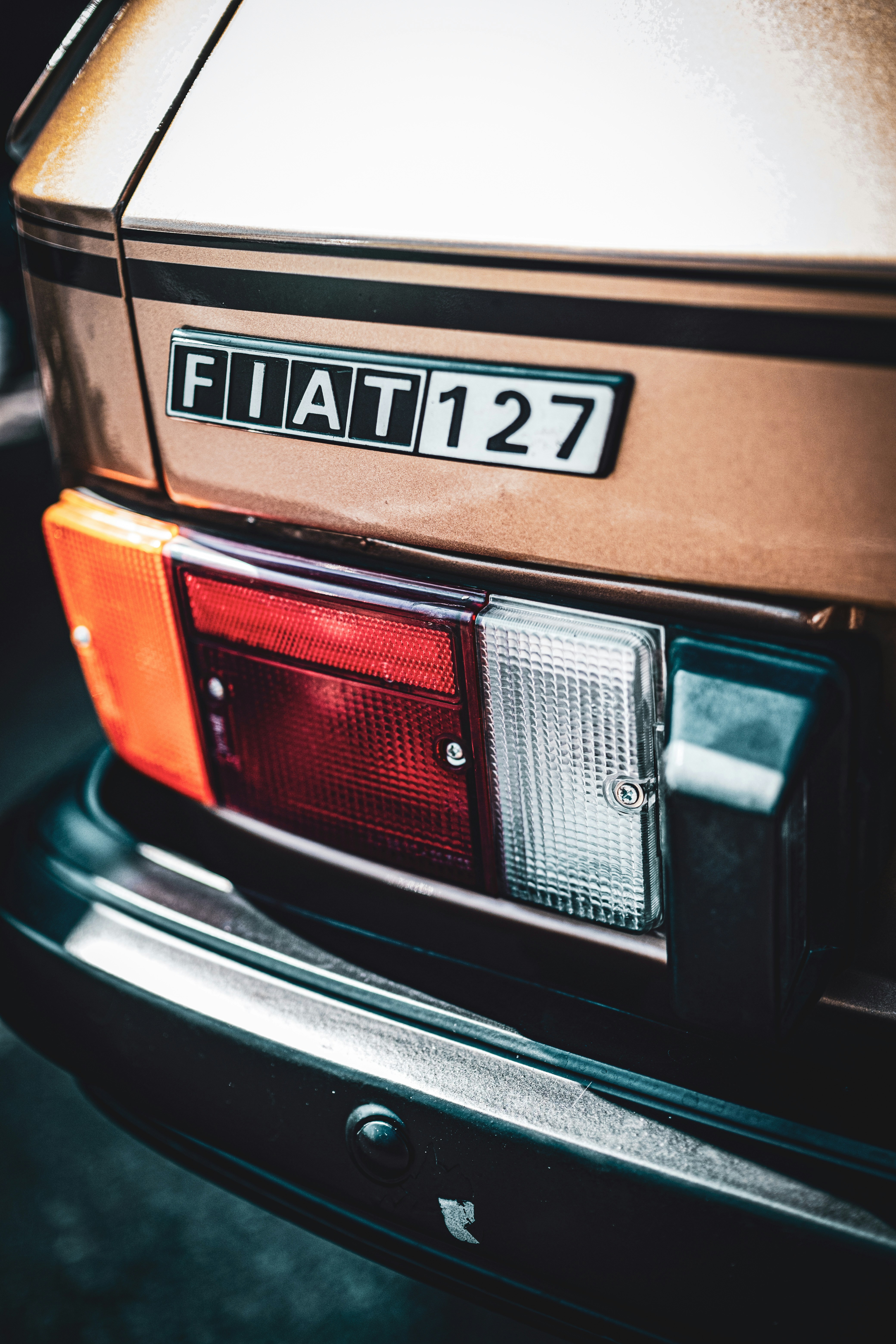 Badge of Classic Character: Fiat 127 Tail Lights in Warm Light