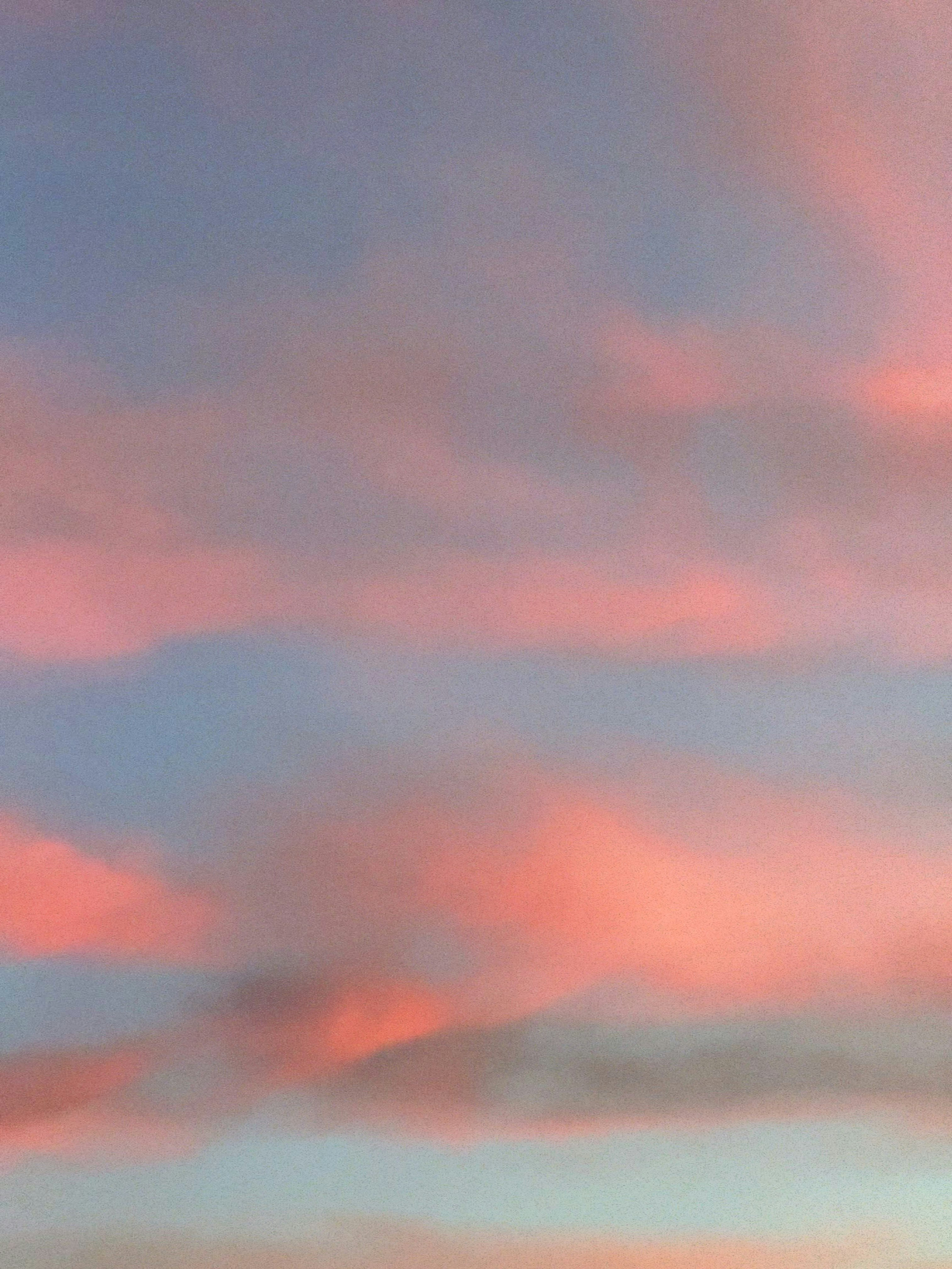 Soft Coral Skies: Gentle Clouds at Sunset