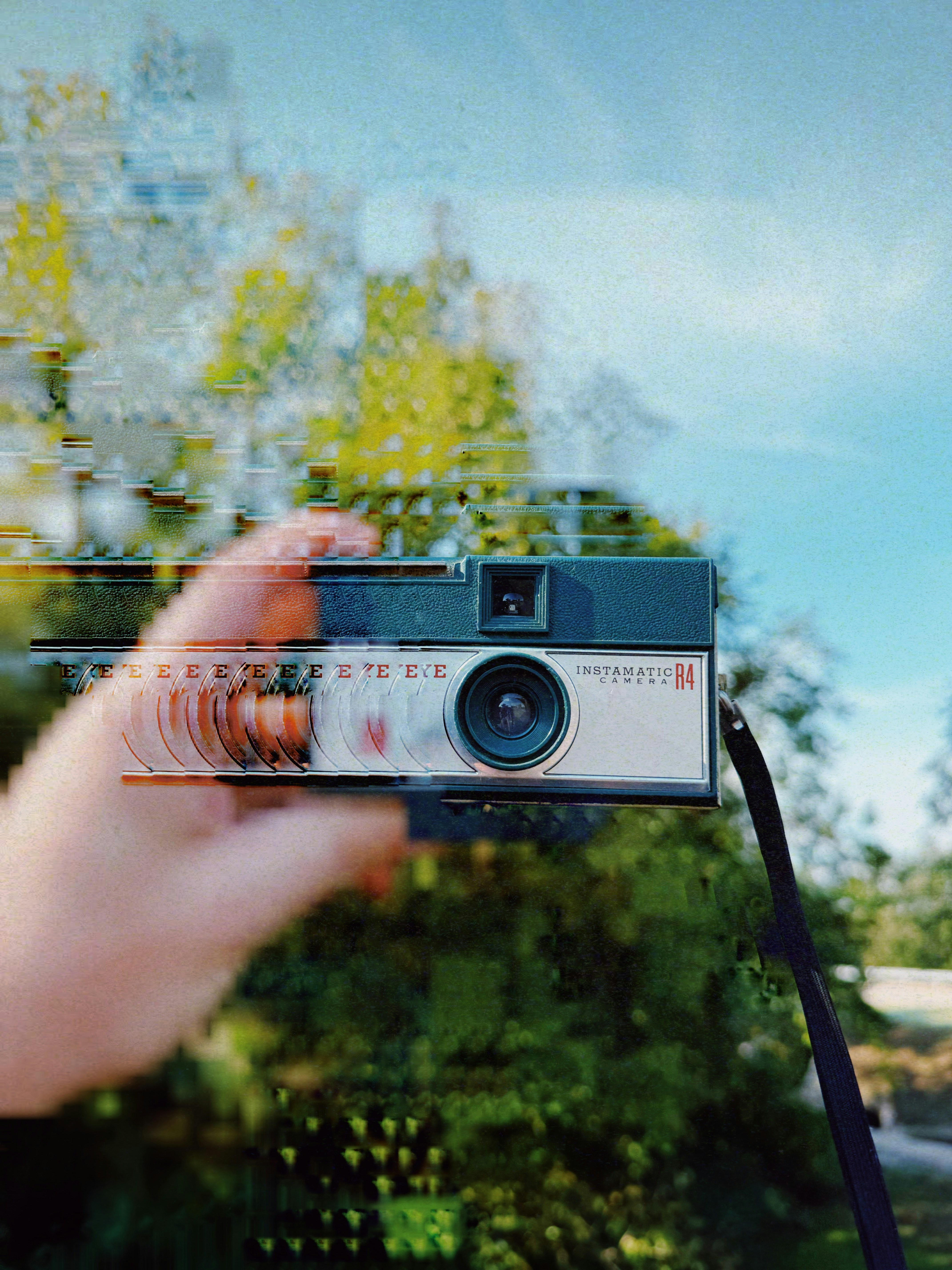 Glitched Vintage Moment: Handheld Instamatic Capture in Blooming Light
