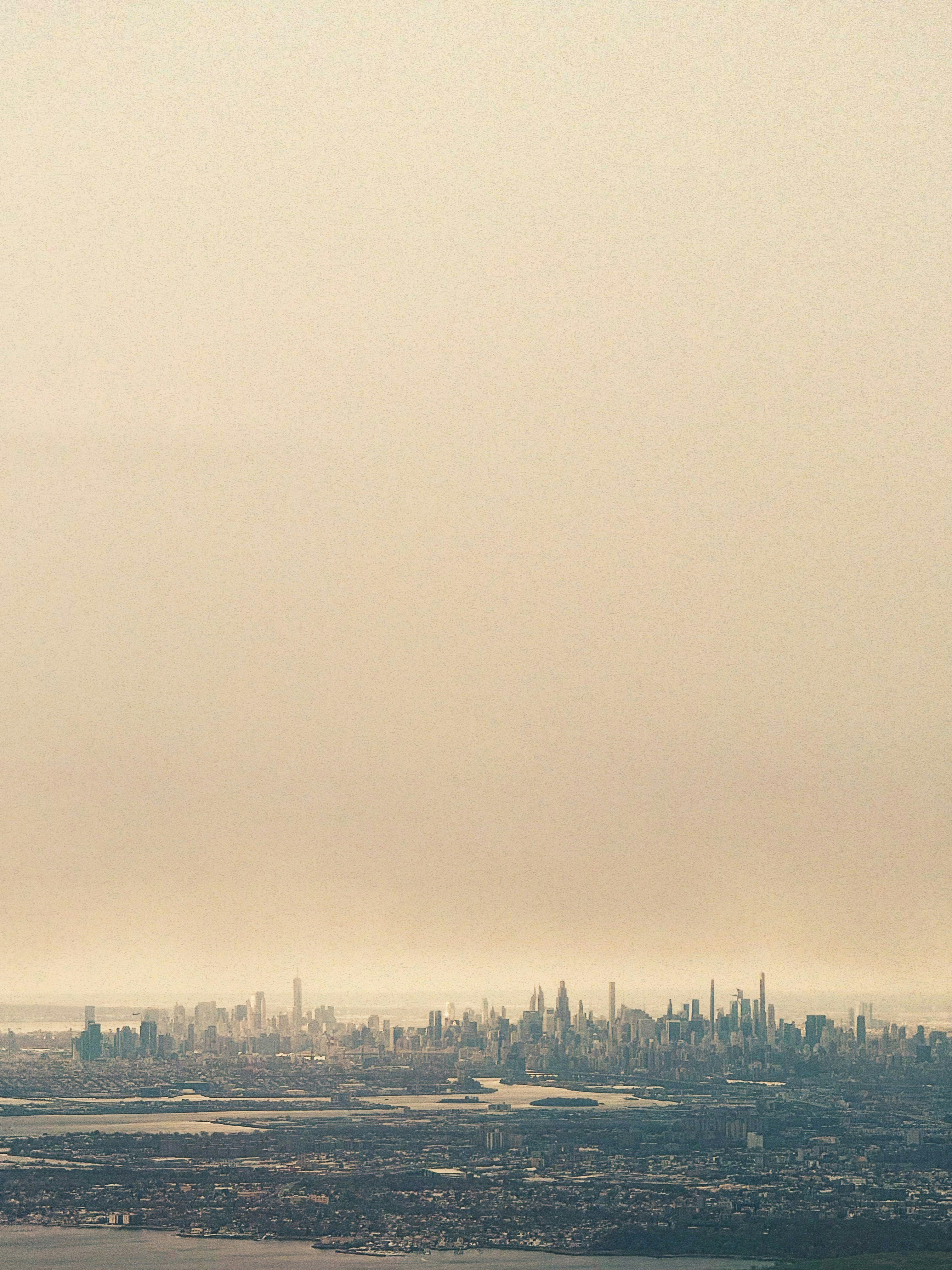 Low Harbor Horizon: City Silhouette Above Quiet Waterfront