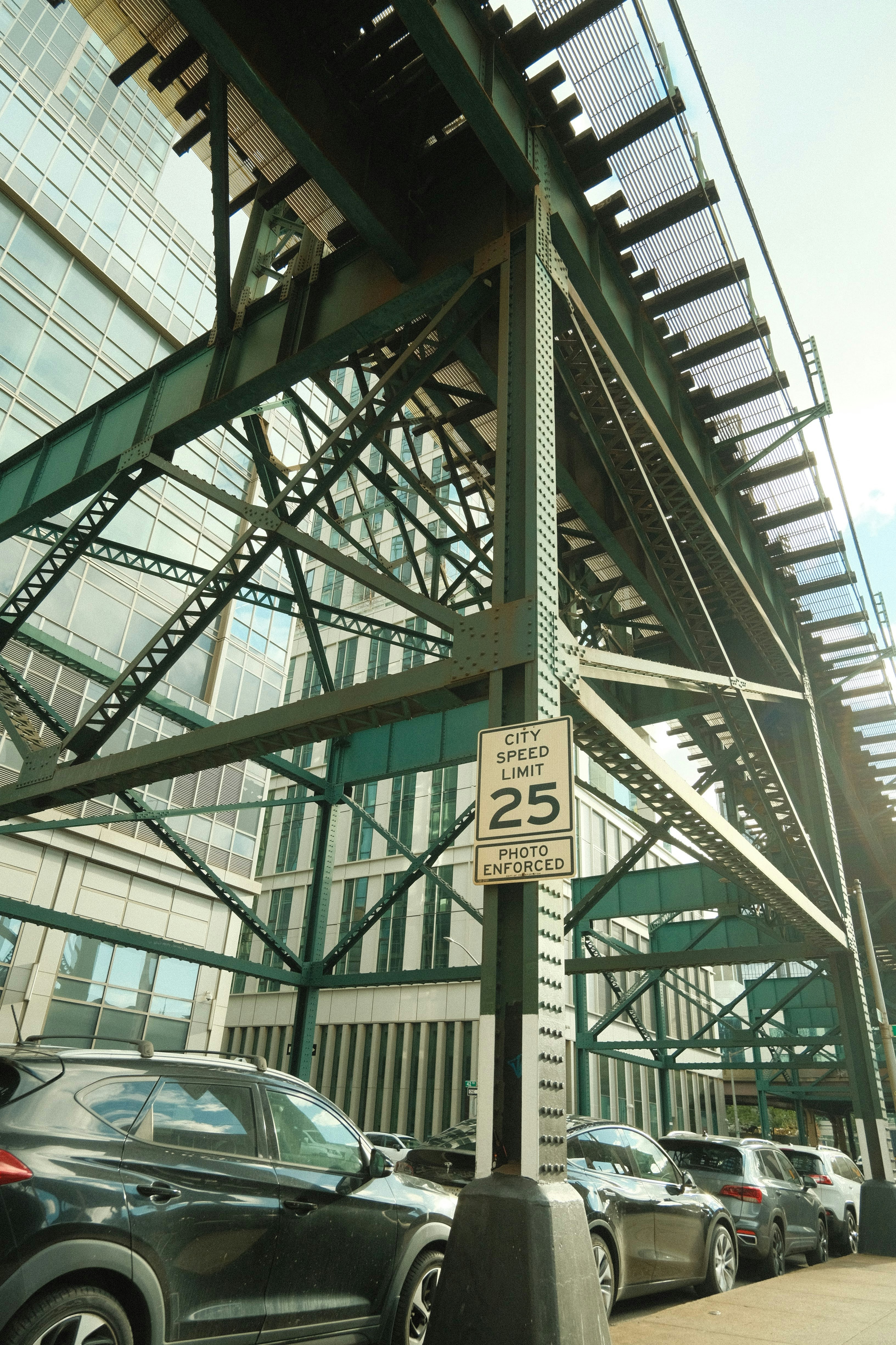 Steel Backbone Overhead: Geometry and Traffic Under a City Bridge