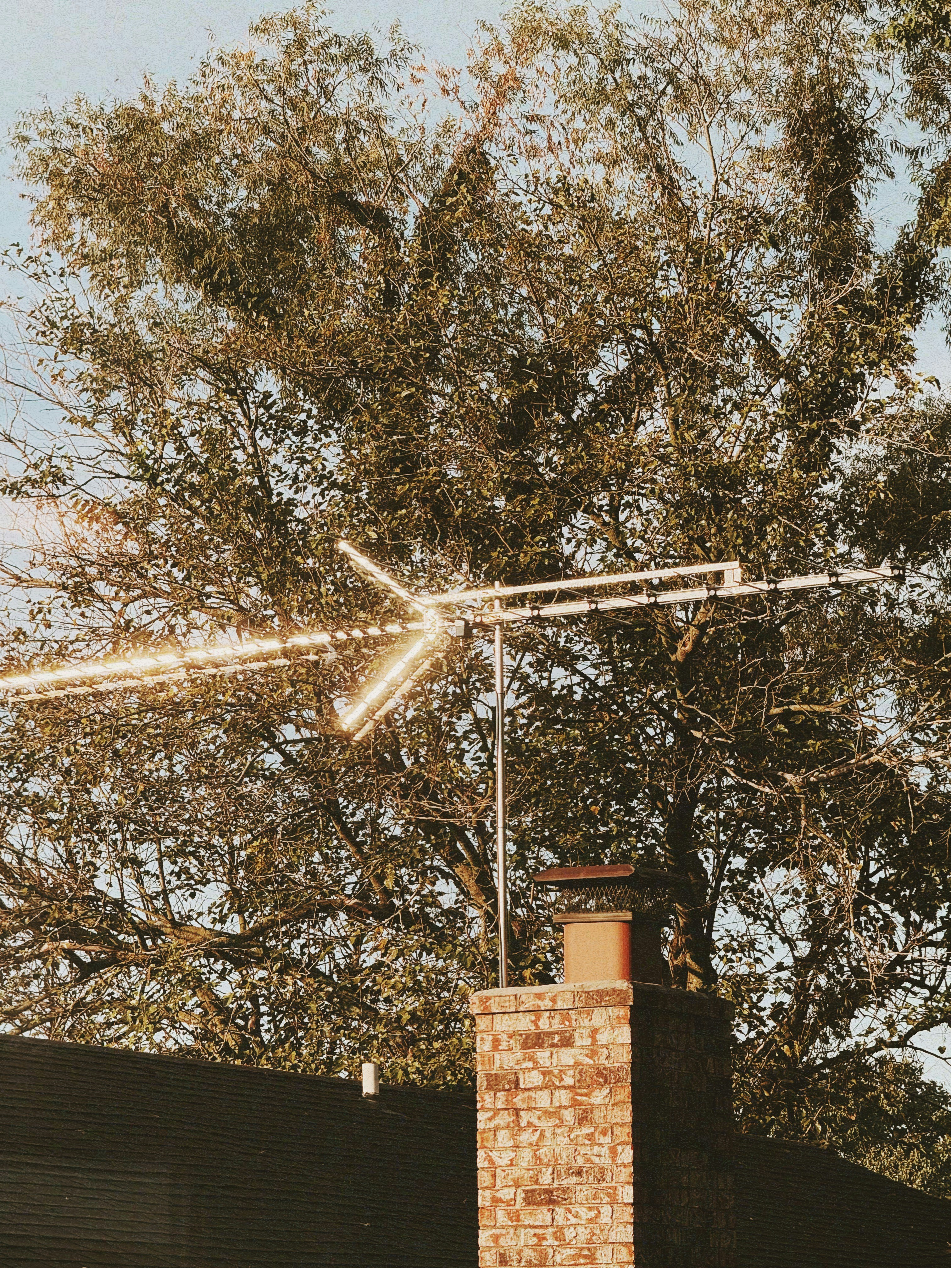 Chimney Against a Spark of Sunset Light