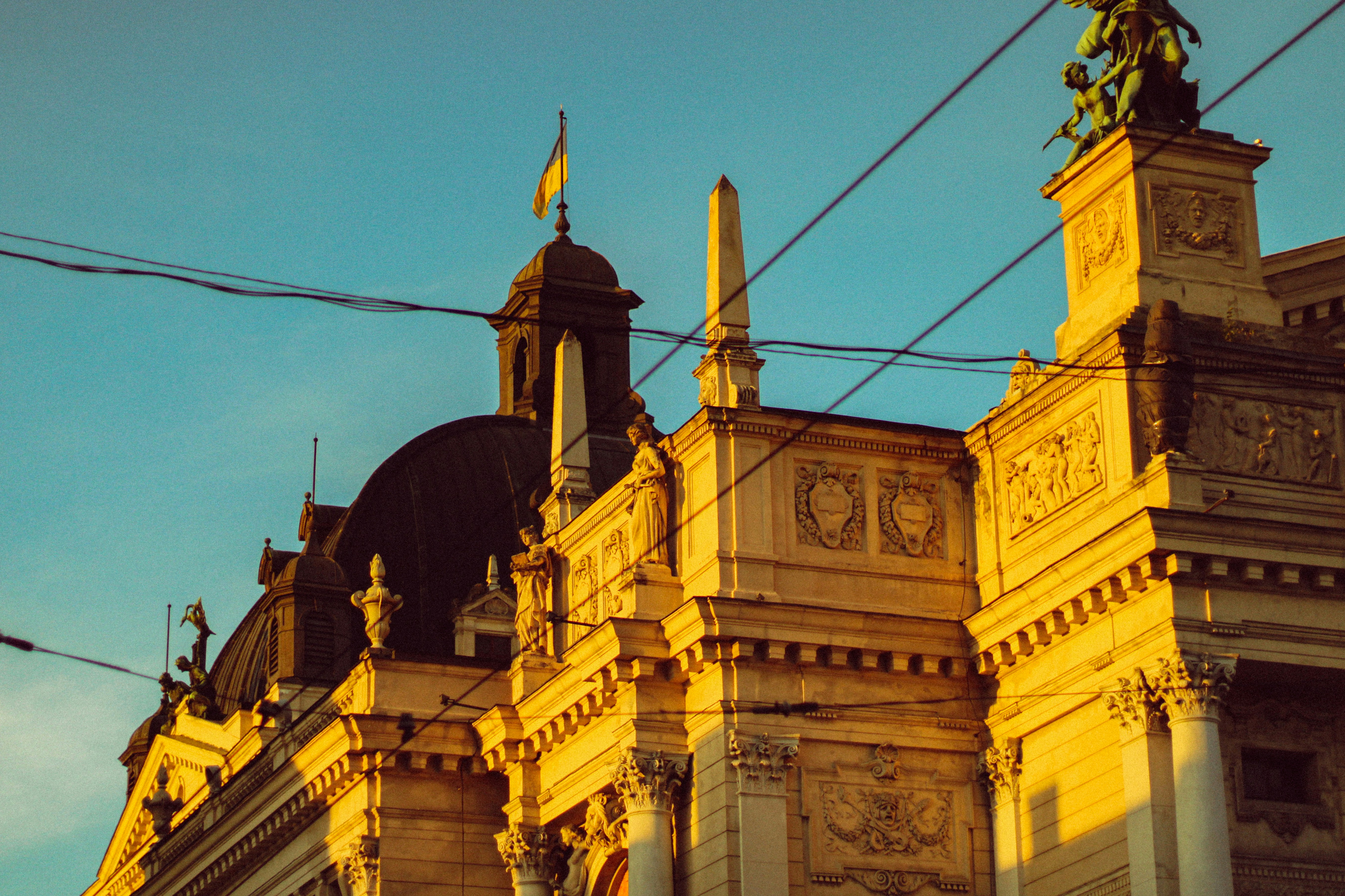 Golden Hour Crest: Ornate Facade Bathed in Morning Light