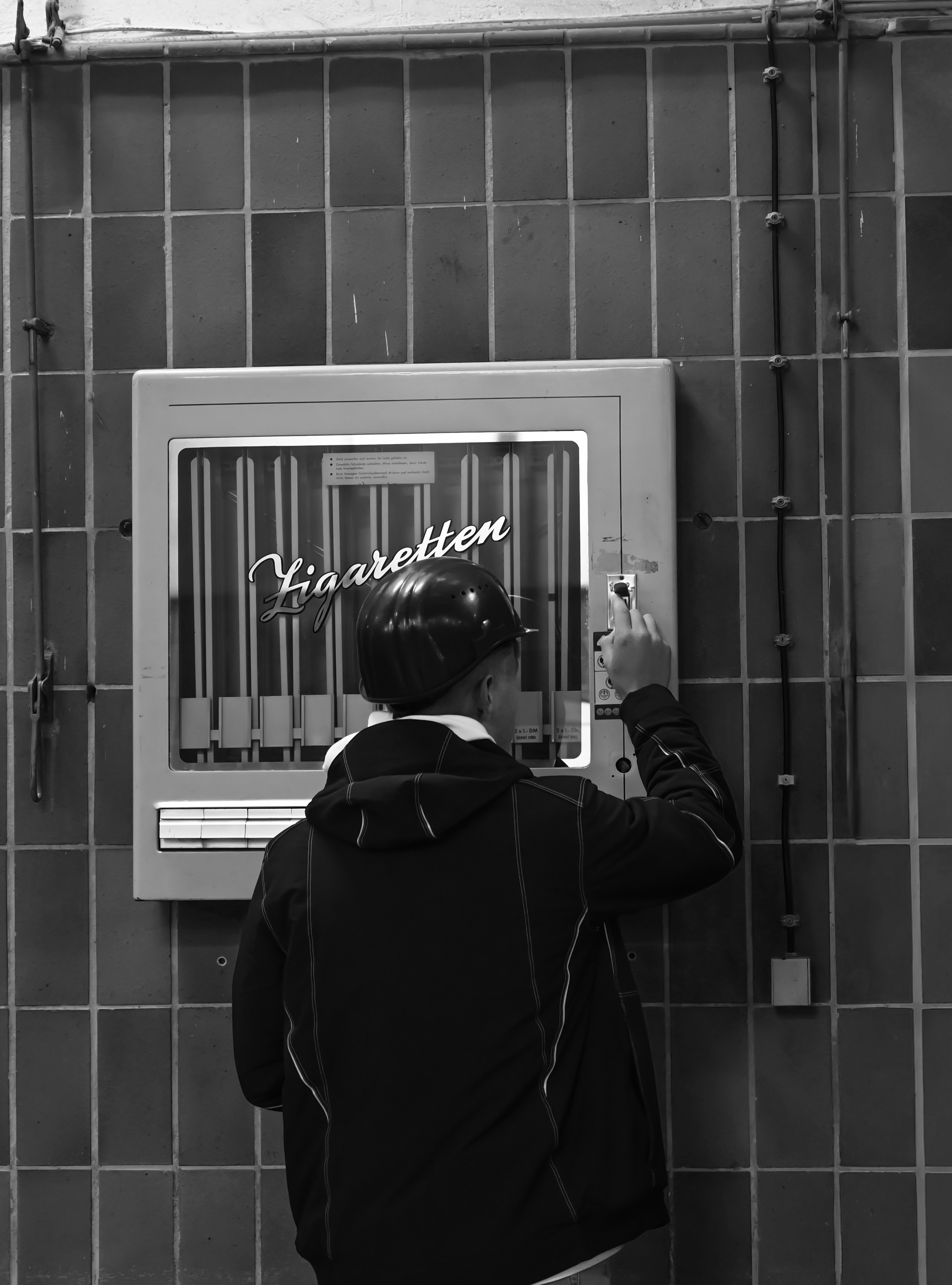 Operator at the Cigarette Vending Glass: A Mono Moment